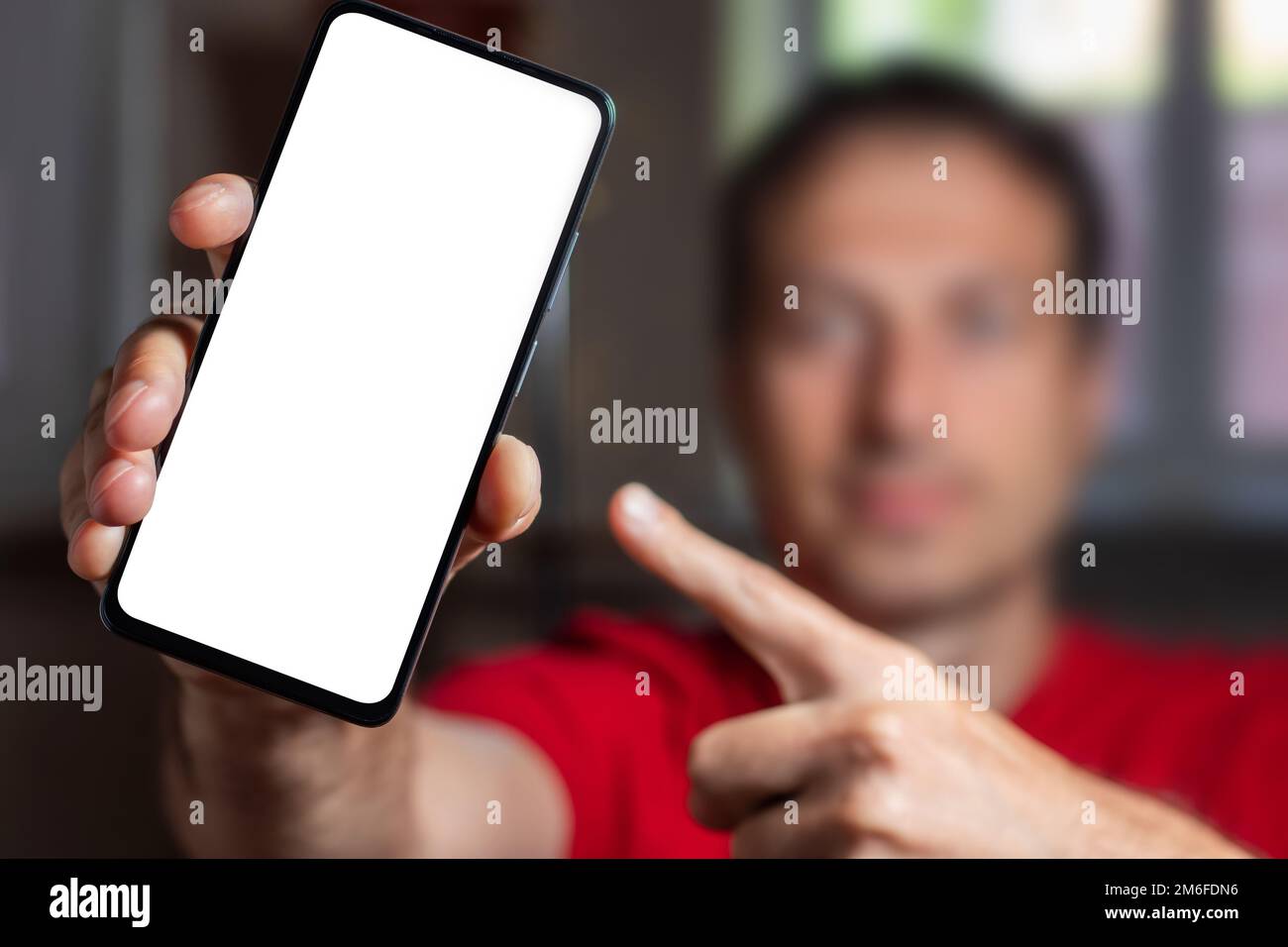 Recommendation. Portrait of excited guy holding big smartphone with ...