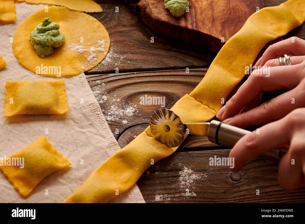 Raw homemade ravioli pasta with spinach and ricotta Stock Photo - Alamy