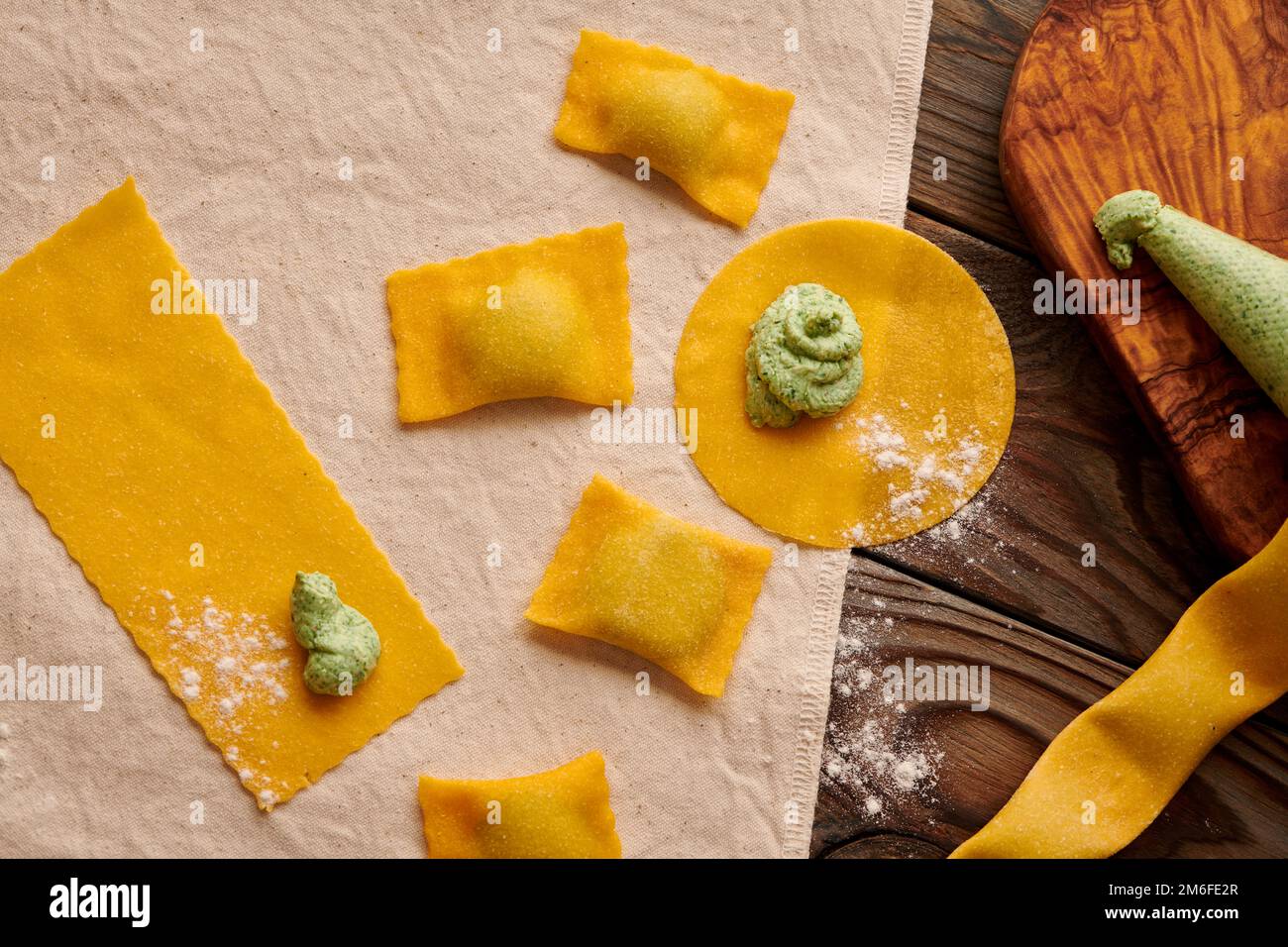 Raw homemade ravioli pasta with spinach and ricotta Stock Photo - Alamy