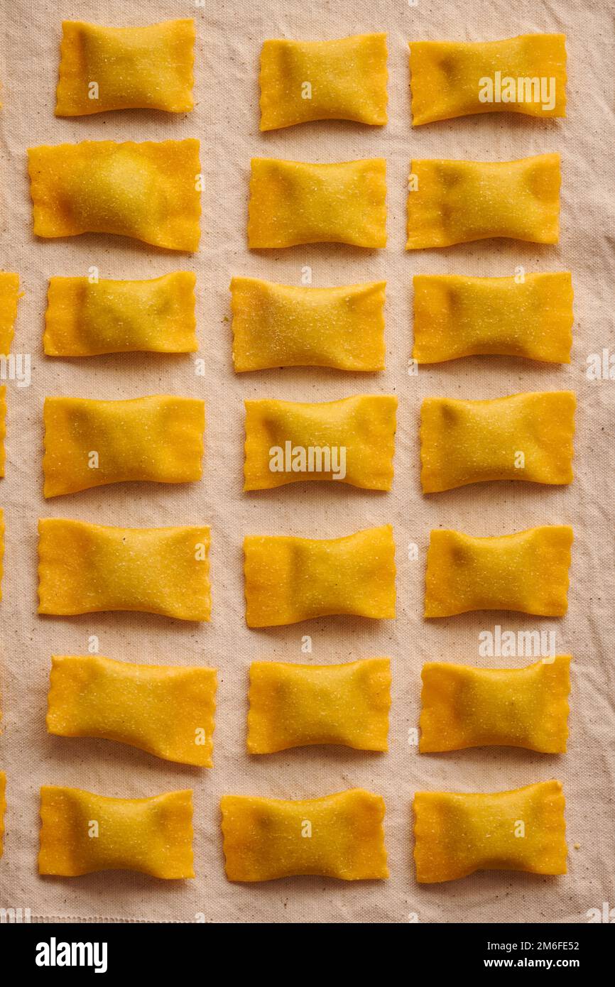 Raw homemade ravioli pasta with spinach and ricotta Stock Photo - Alamy