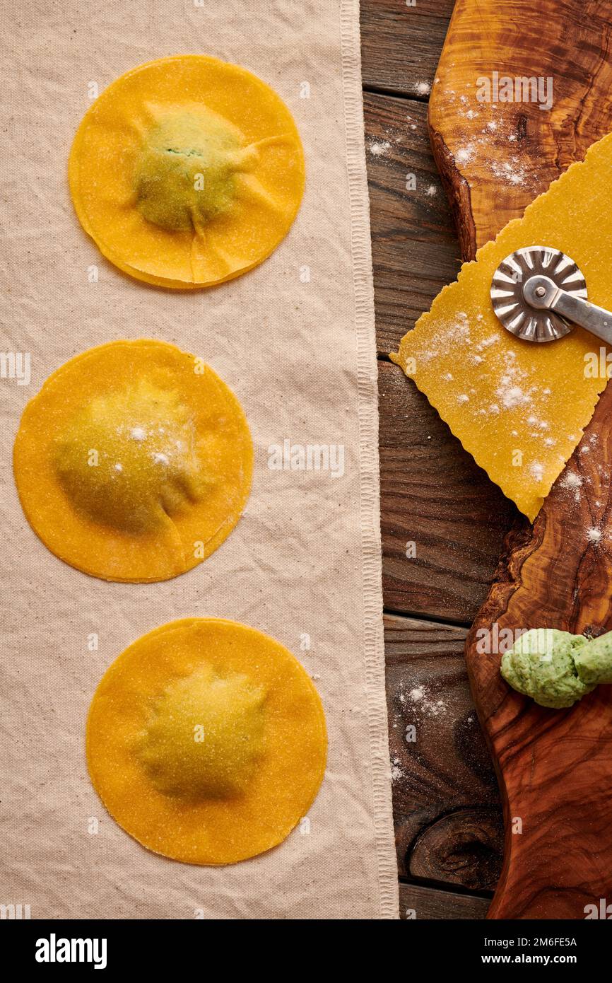 Raw homemade ravioli pasta with spinach and ricotta Stock Photo - Alamy