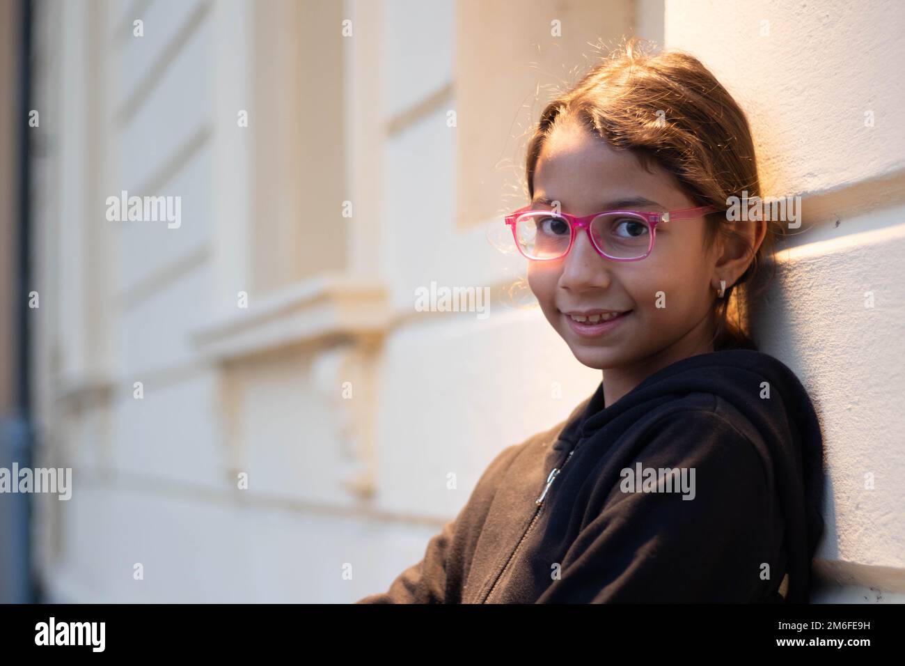Brunette girl portrait with glasses unfocused background Stock Photo ...