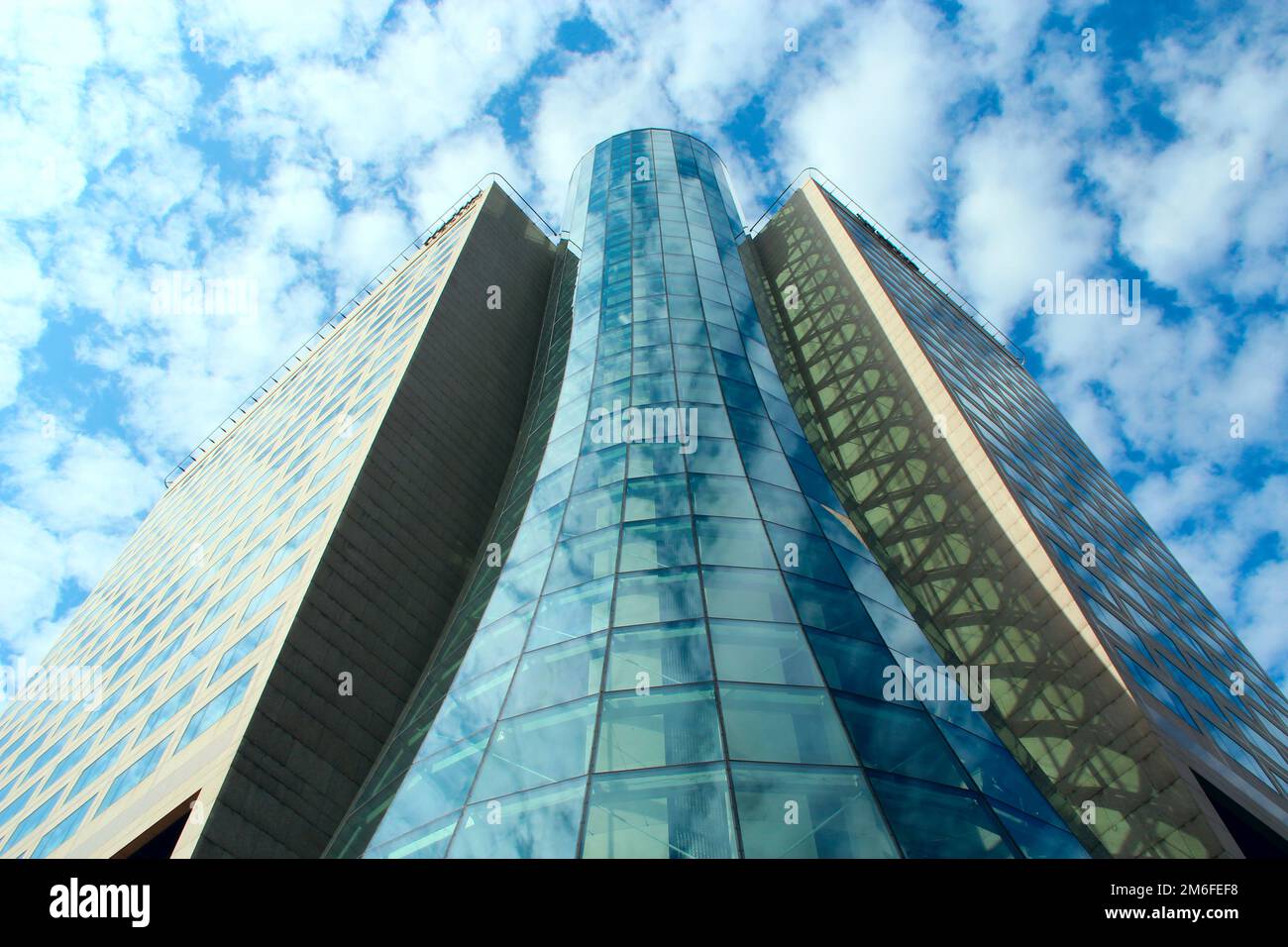 High glass skyscraper in Warsaw. Modern architecture of city buildings ...