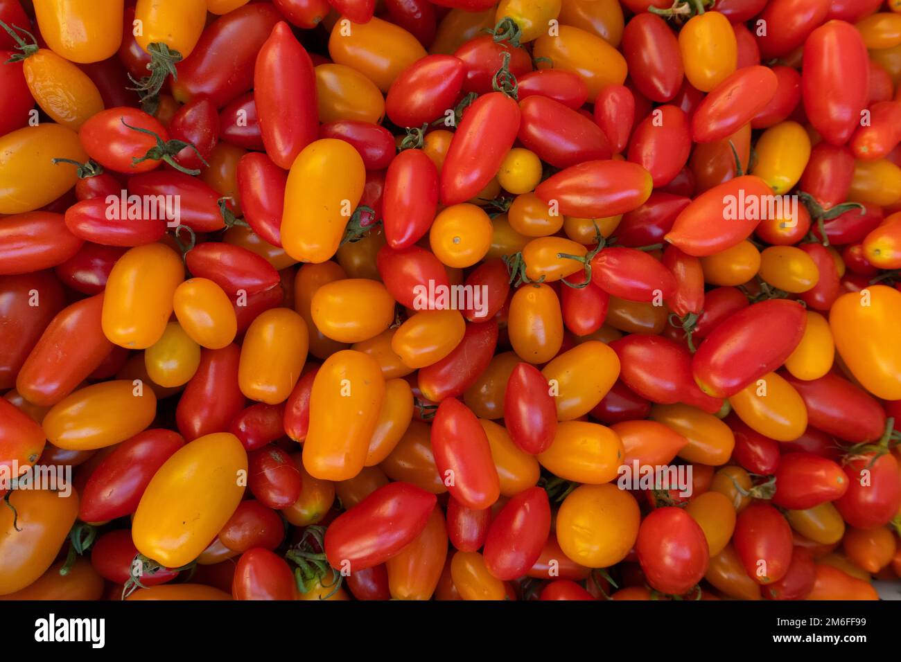 Red cherry pear tomatoes from the organic market Stock Photo - Alamy