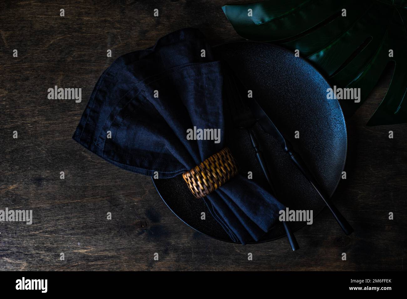 Cutlery set on black background Stock Photo - Alamy