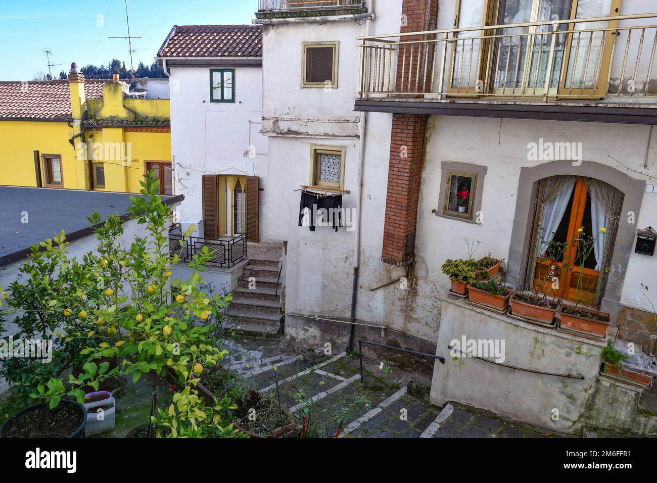 A narrow street among the old houses of Rapolla, a village in the ...