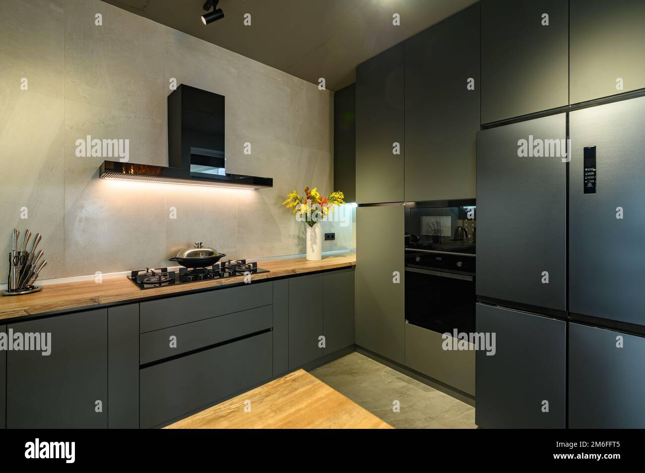 Modern large luxury dark gray kitchen closeup Stock Photo - Alamy