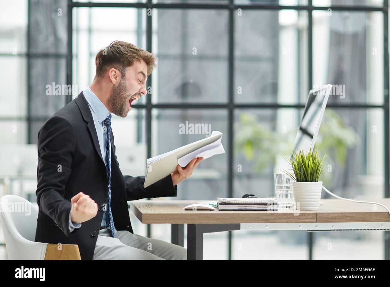 funny male employee have fun perform winner in modern office Stock ...