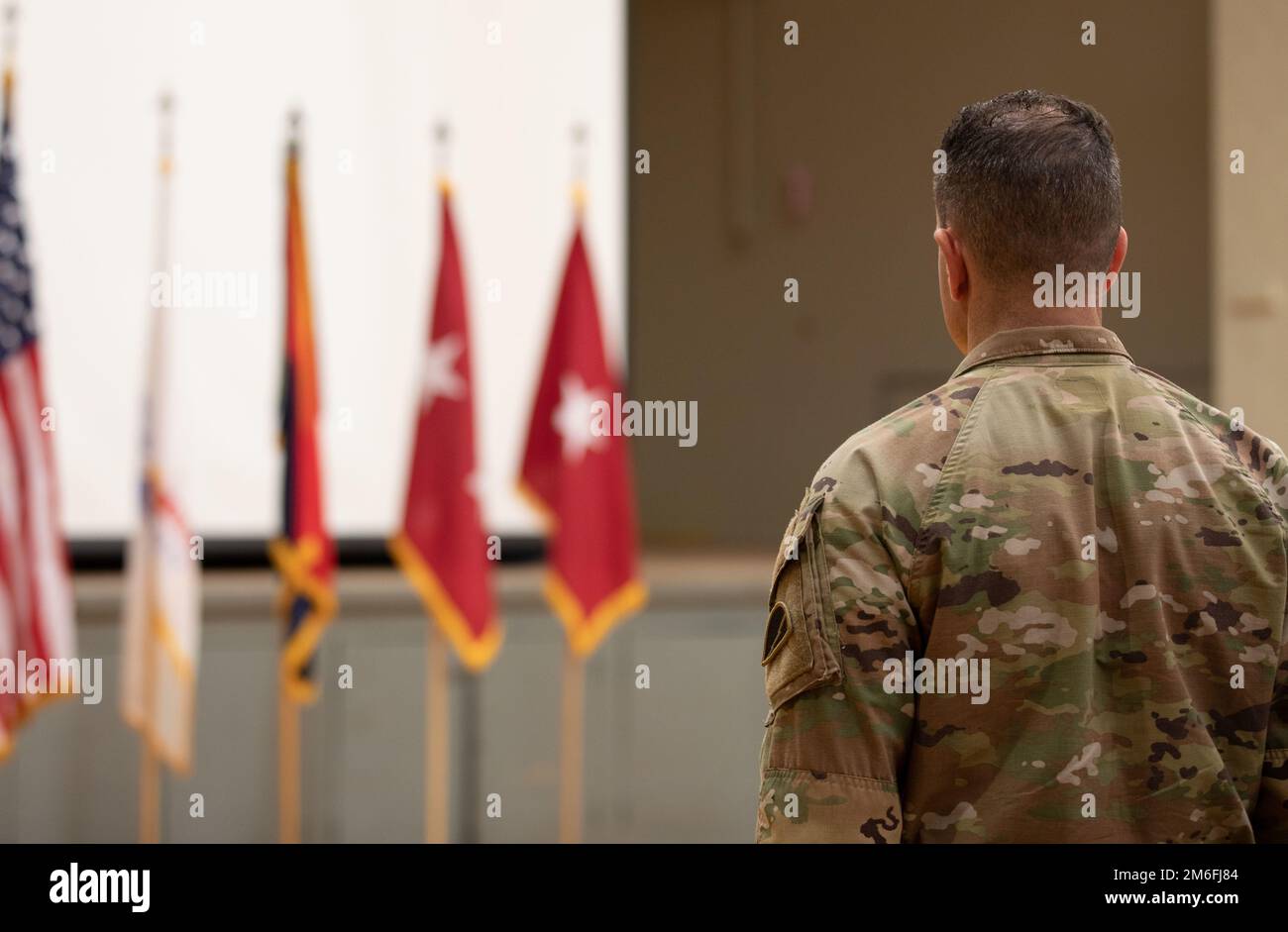 An Army Reserve soldier stands at attention for the playing of the ...