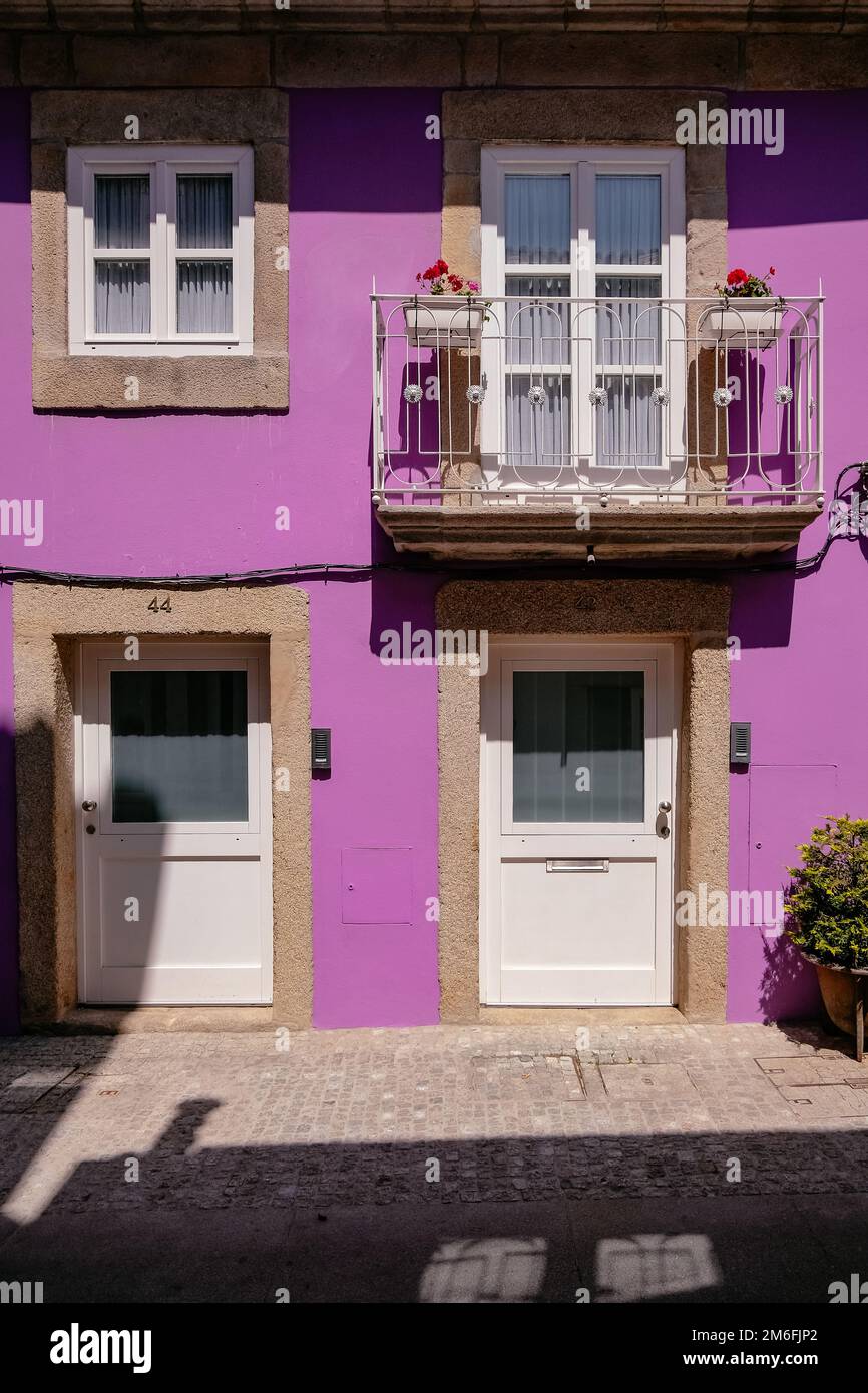 Pink Facade of a Traditional Small House Building with Small Balcony ...