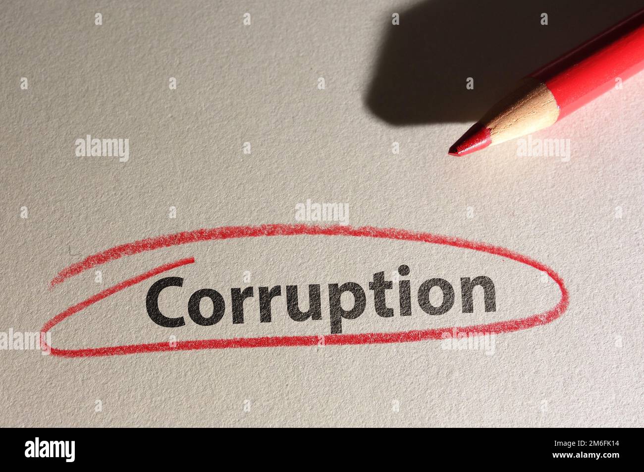 Corruption text circled in red pencil on texured paper Stock Photo - Alamy