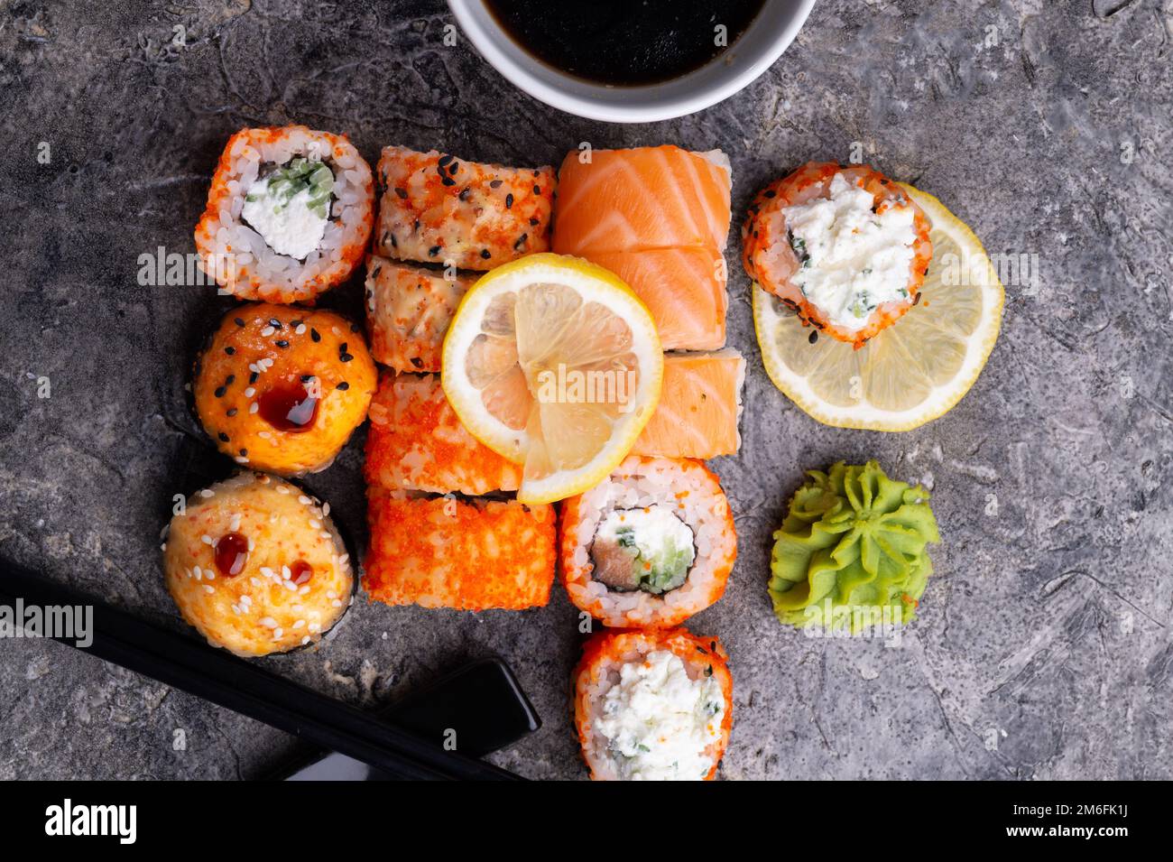 Sushi roll set served at grey table. flat lay. close up Stock Photo - Alamy