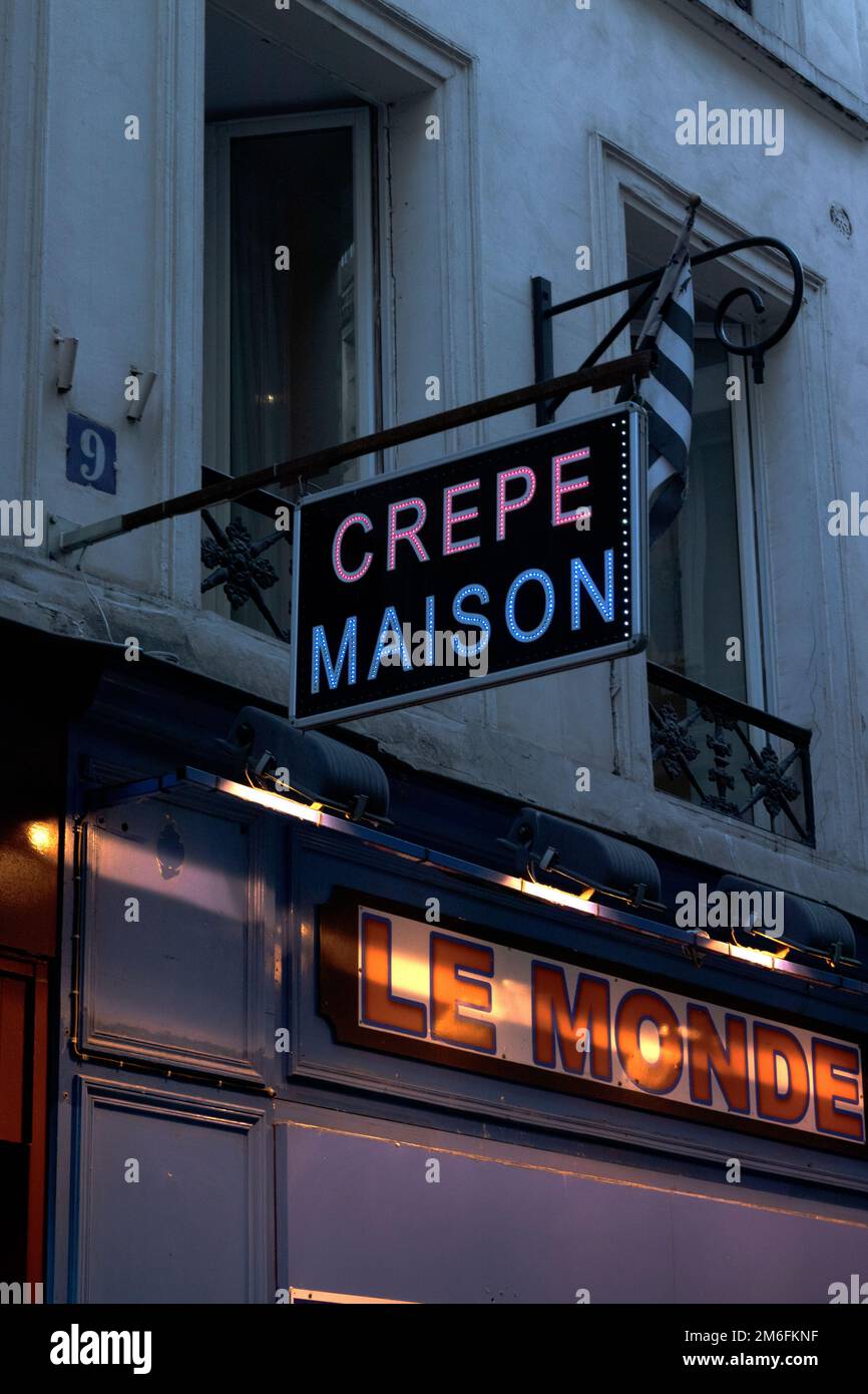 Illuminated sign of a crepe shop in Paris Stock Photo - Alamy