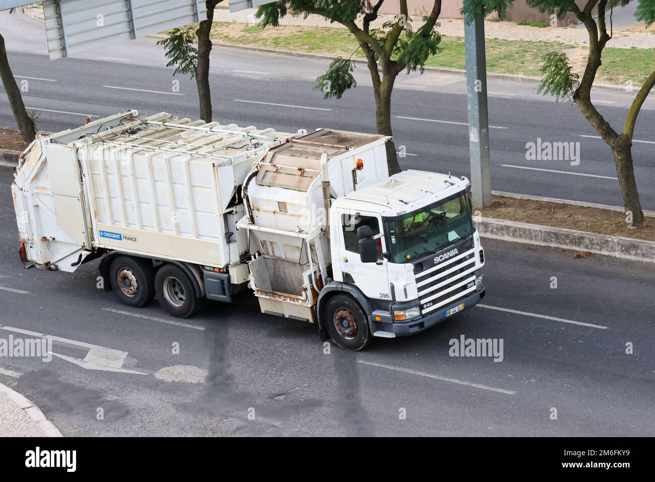 The Garbage collection truck in the city of Lisbon Stock Photo - Alamy