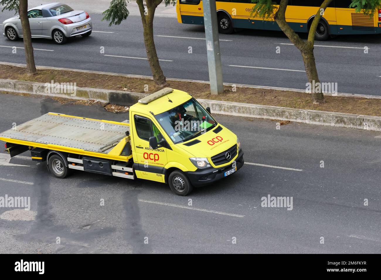 The yellow road assistance vehicle on the street Stock Photo - Alamy