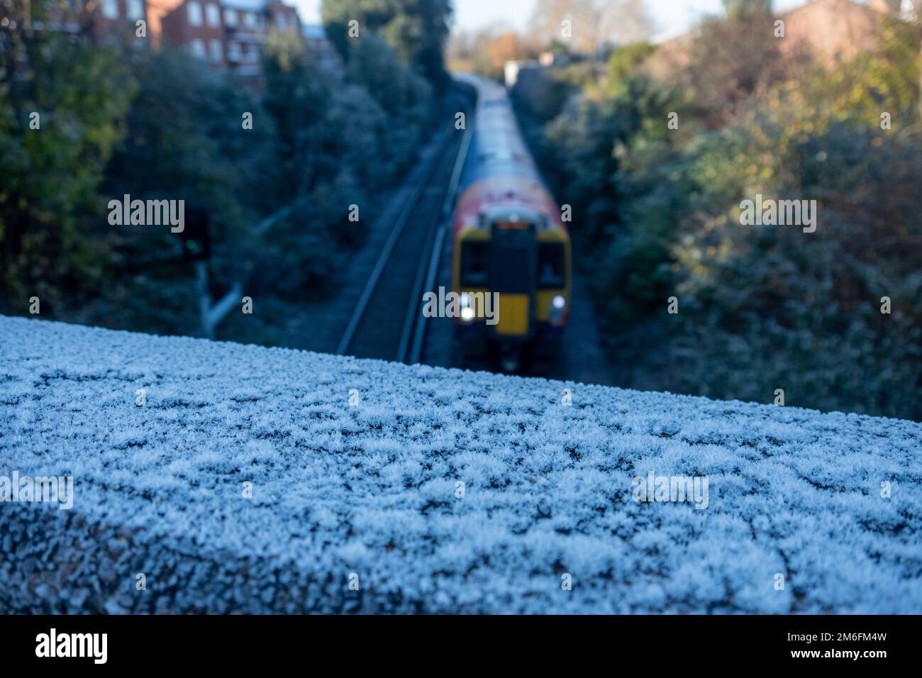 UK- Frozen conditions and suburban London commuter train in south west ...