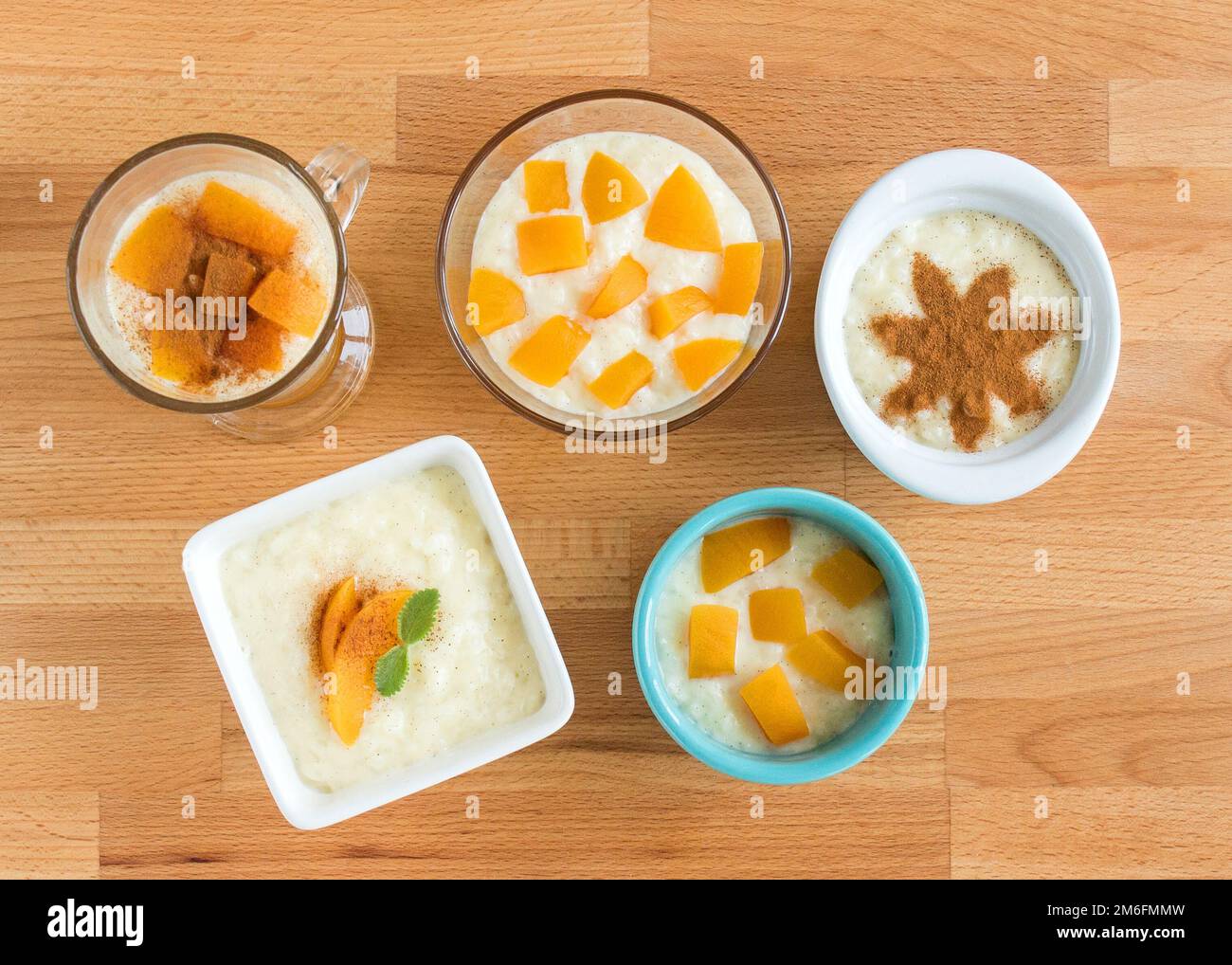 Sweet rice pudding in various beautiful plates. Top view, nobody Stock ...