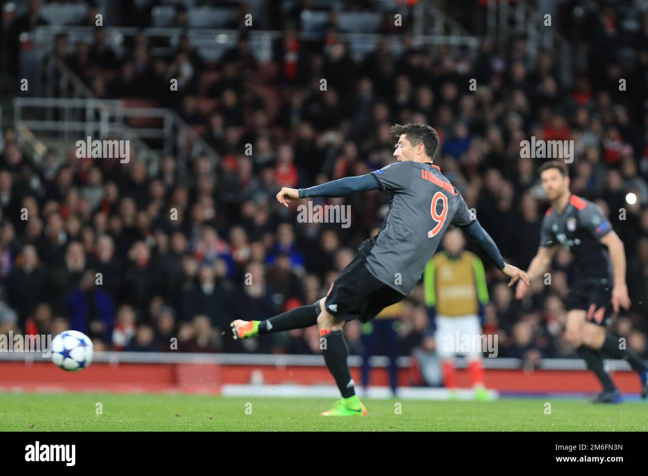 Robert Lewandowski of Bayern Munich scores a penalty making it 1-1 ...
