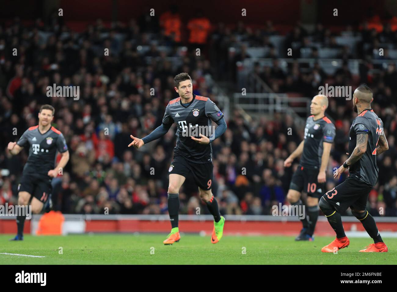 Robert Lewandowski of Bayern Munich celebrates scoring a penalty making ...