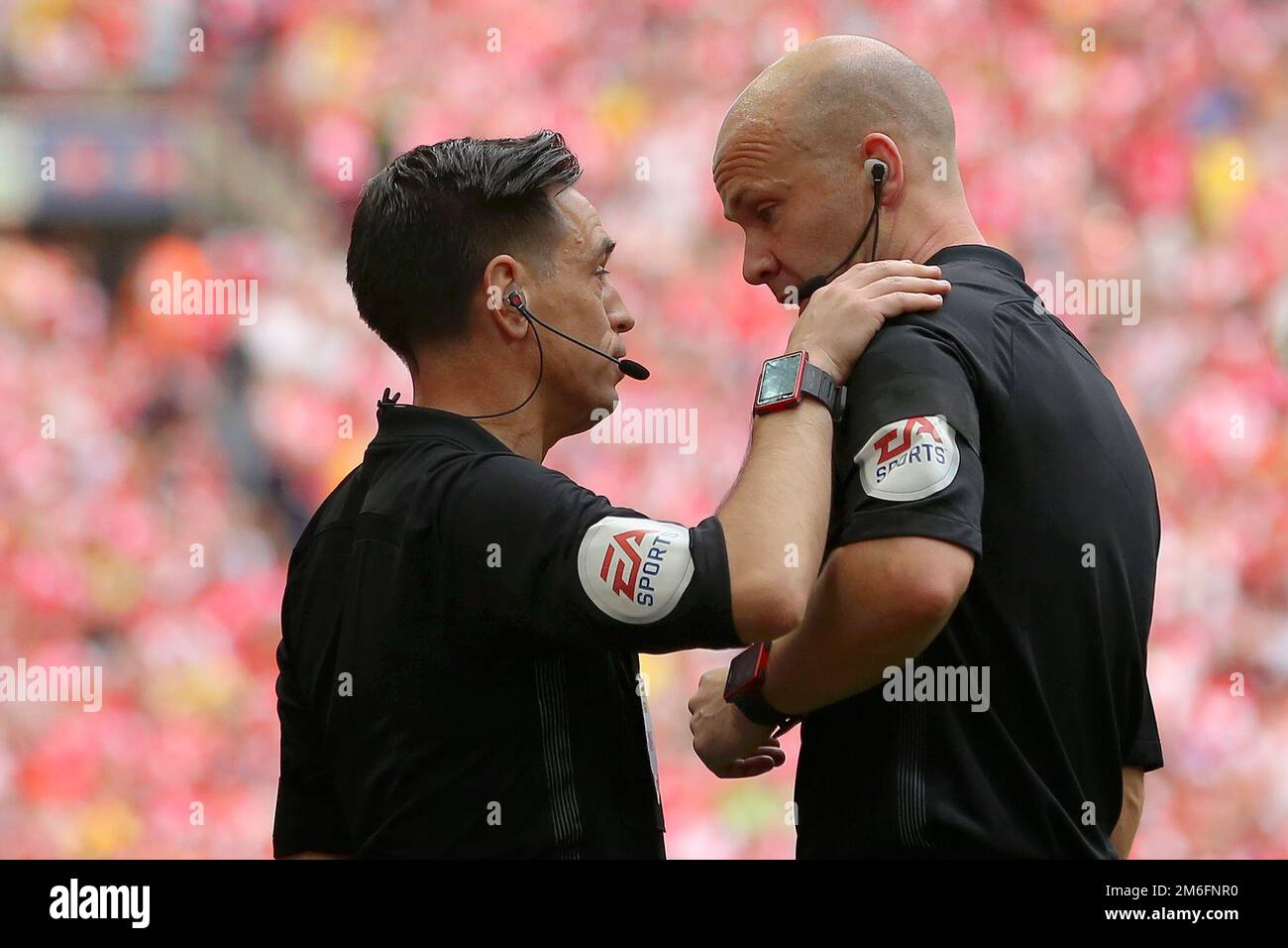Referee, Anthony Taylor consults Assistant Referee, Gary Beswick before ...