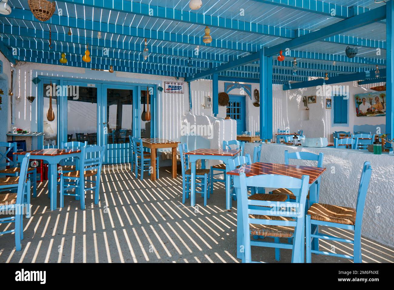 Light patterns illuminates a typical greek taverna Stock Photo - Alamy