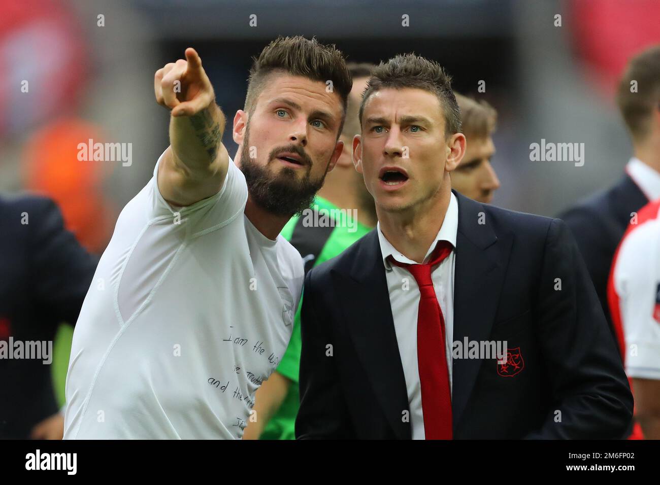 Olivier Giroud and Laurent Koscielny of Arsenal point out family in the ...