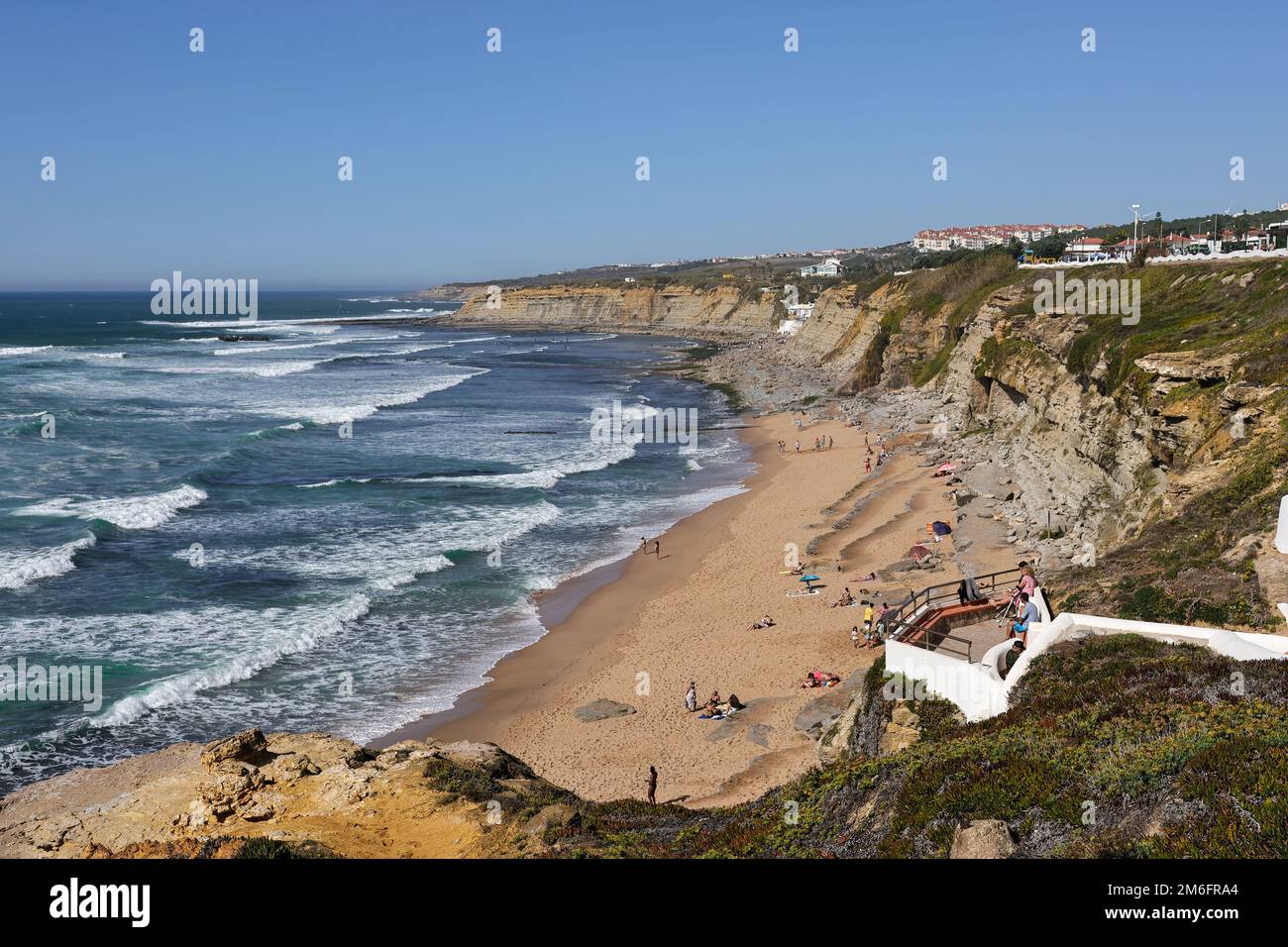 A beautiful shot of the sunny Sao Sebastiao beach in Ericeira village ...