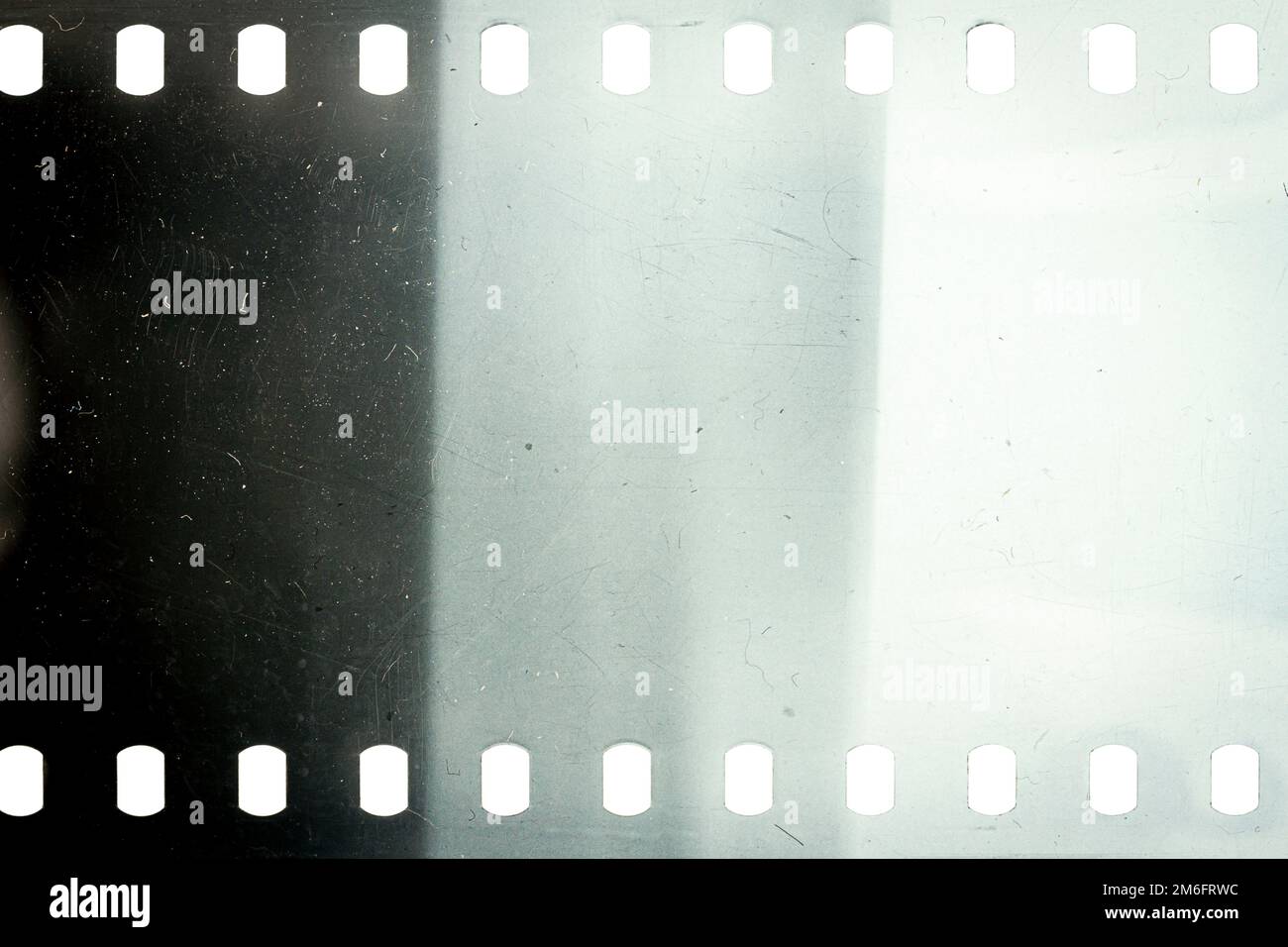 Dusty and grungy 35mm film texture or surface. Perforated scratched ...