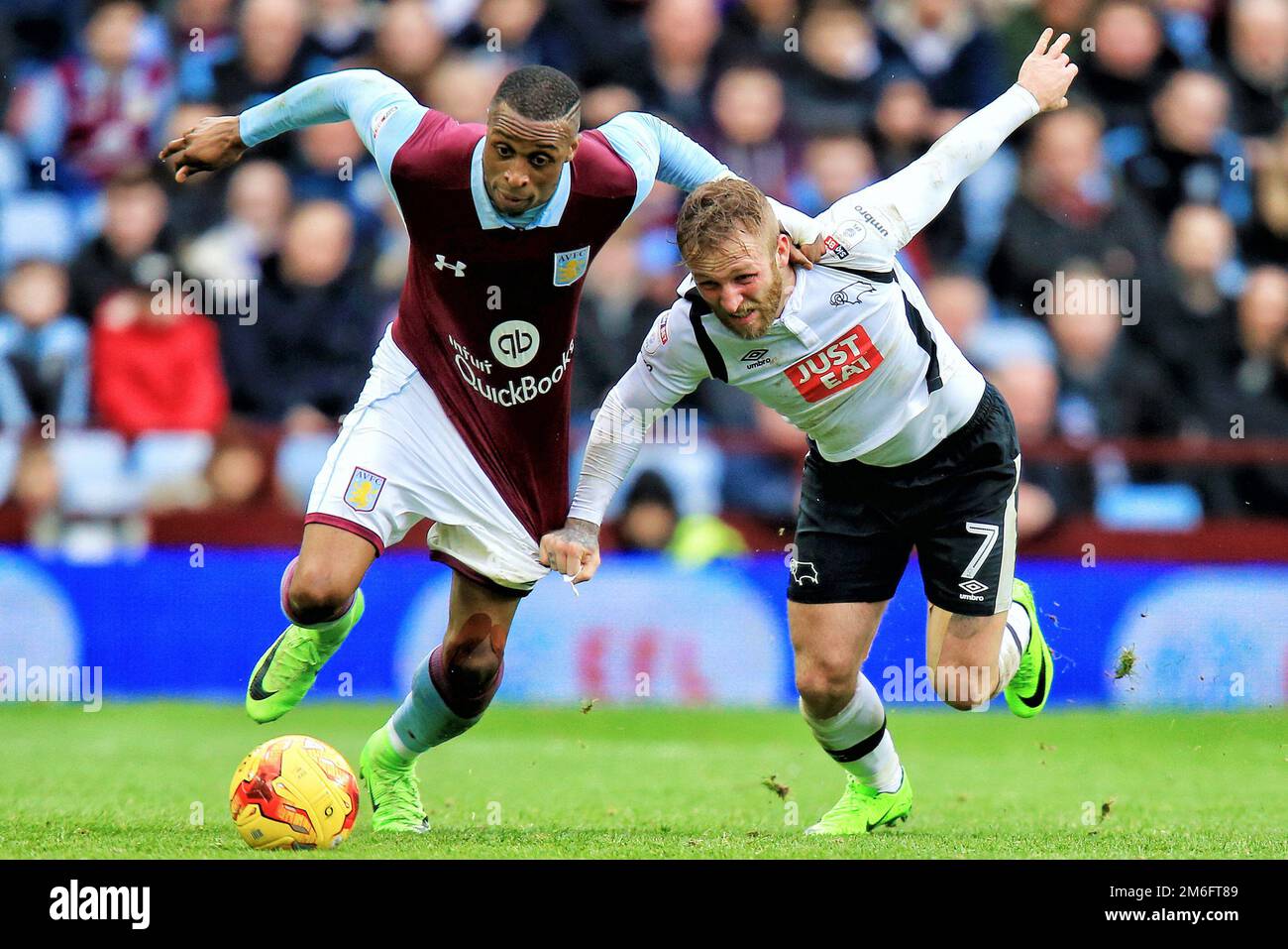 Jonathan Kodjia of Aston Villa battles with Johnny Russell of Derby ...