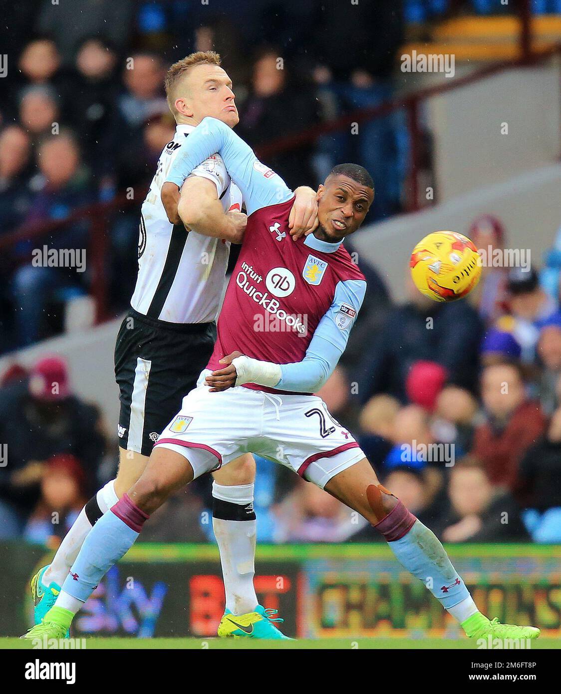 Jonathan Kodjia of Aston Villa battles with Alex Pearce of Derby County ...