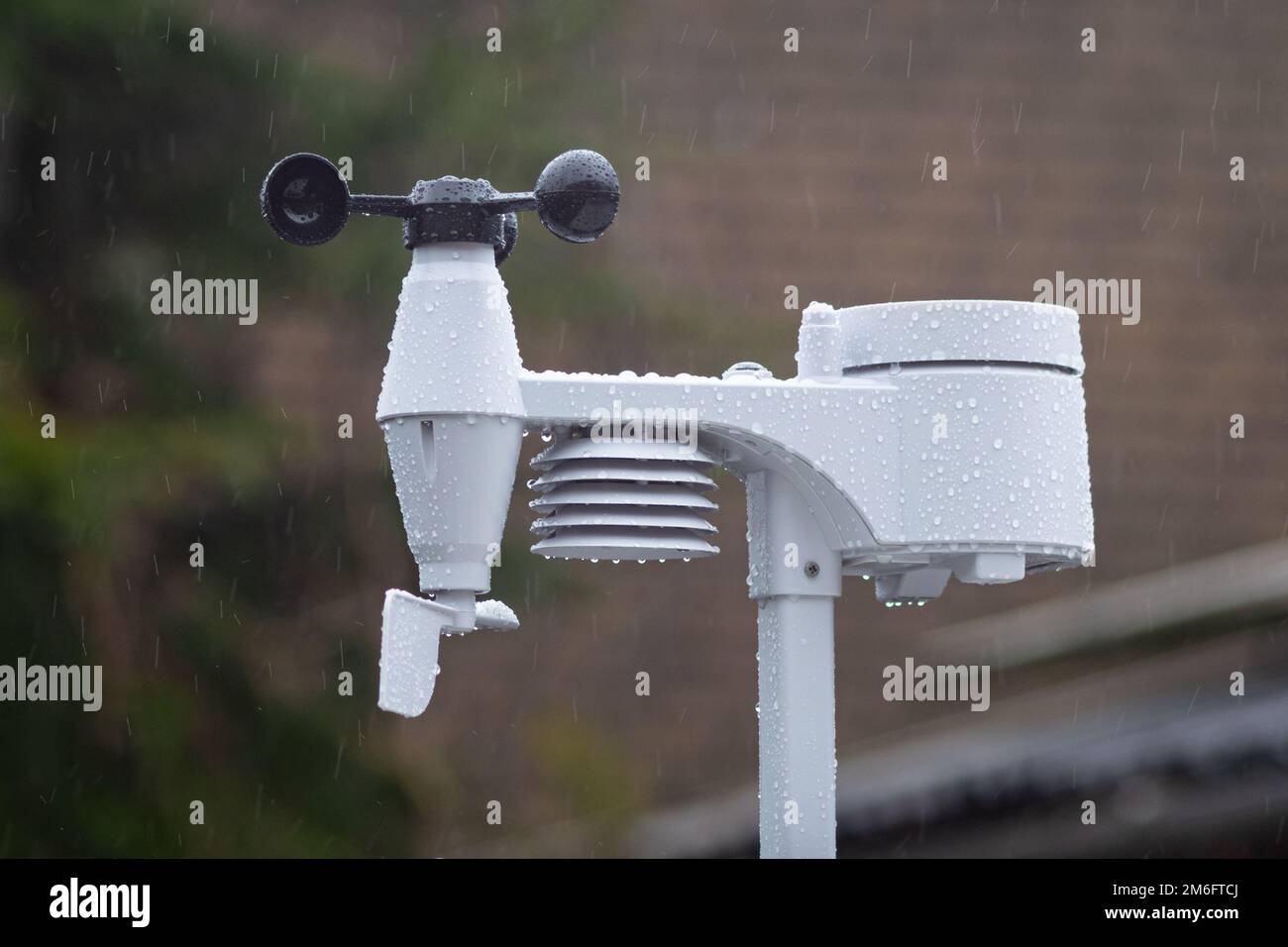 Weather station measuring temperature, humidity, precipitation, wind ...