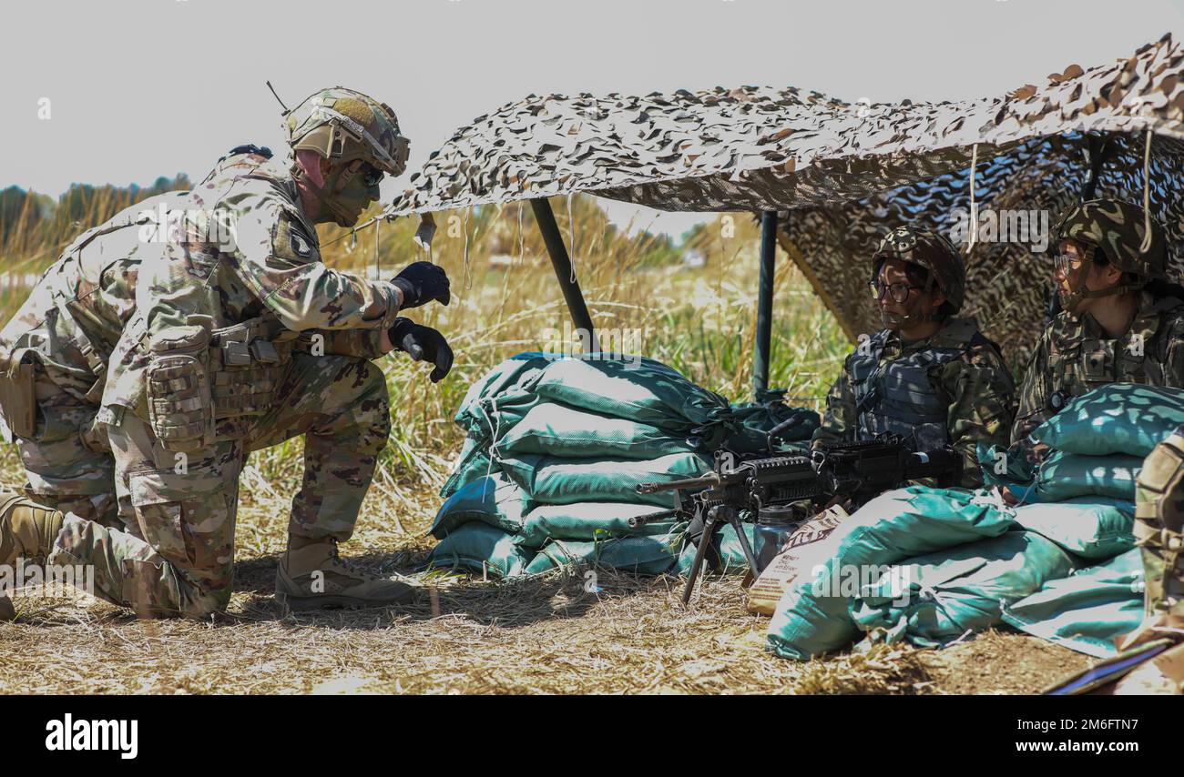 Forces Command (FORSCOM) Command Sgt. Maj. Todd Sims speaks with Spc ...