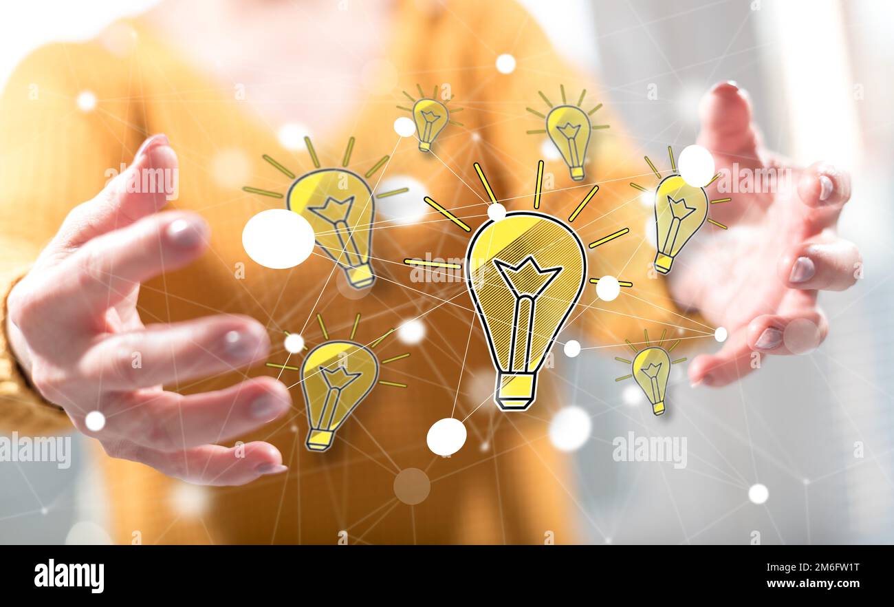 Innovation concept between hands hi-res stock photography and images ...