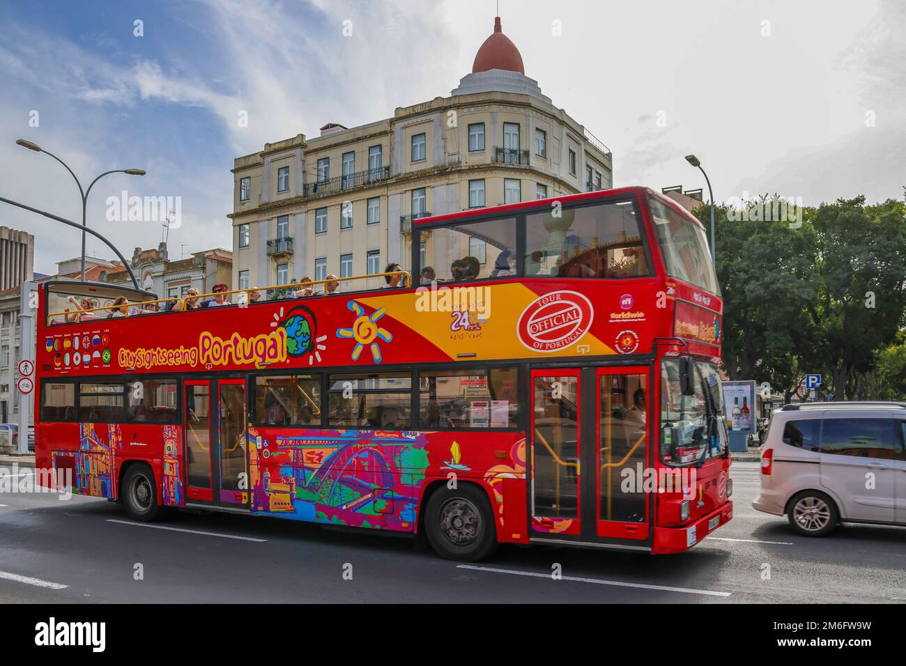 A red double-decker city sightseeing tourist bus in the city of Lisbon ...