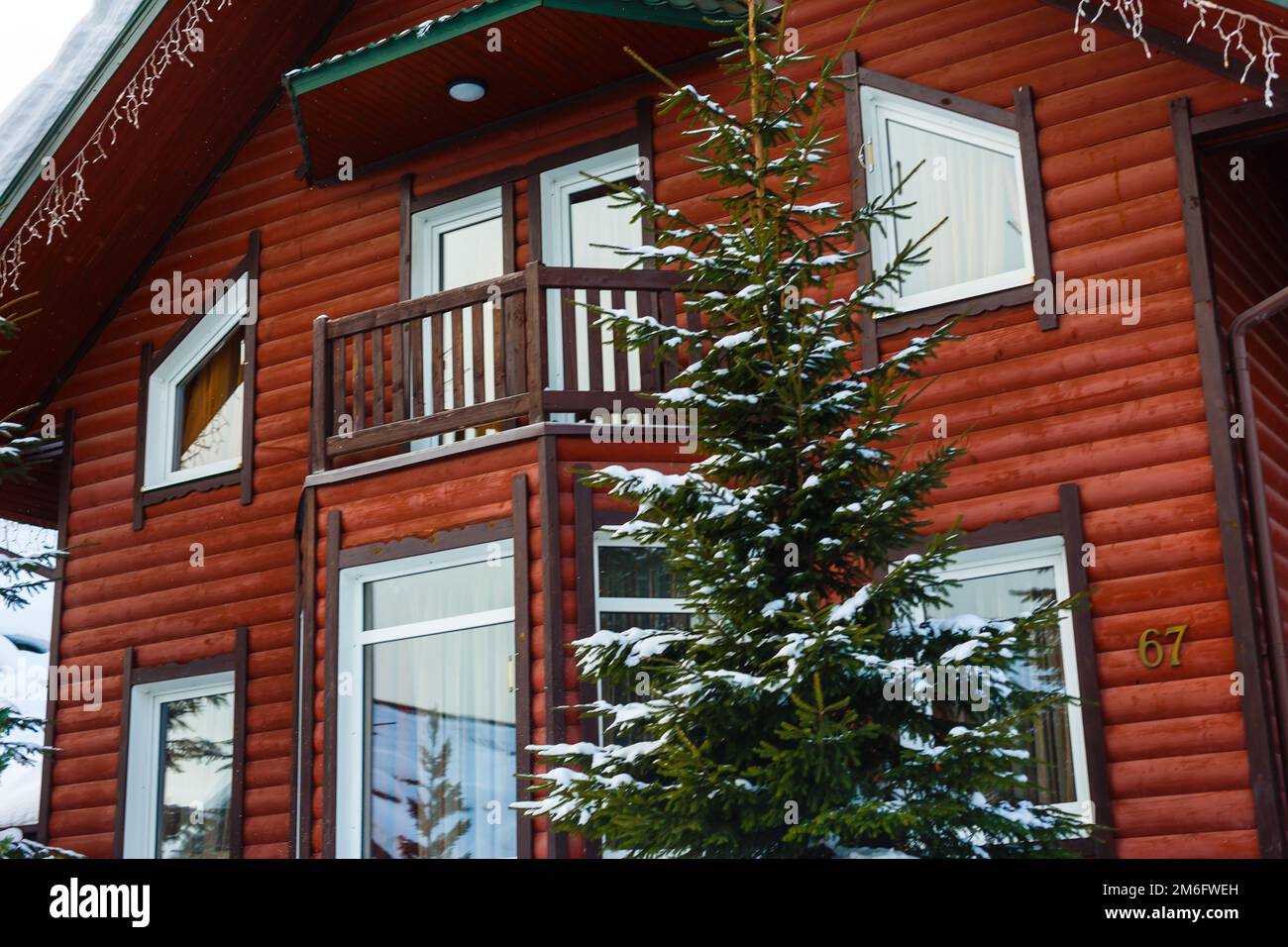 wooden house in winter forest Stock Photo - Alamy