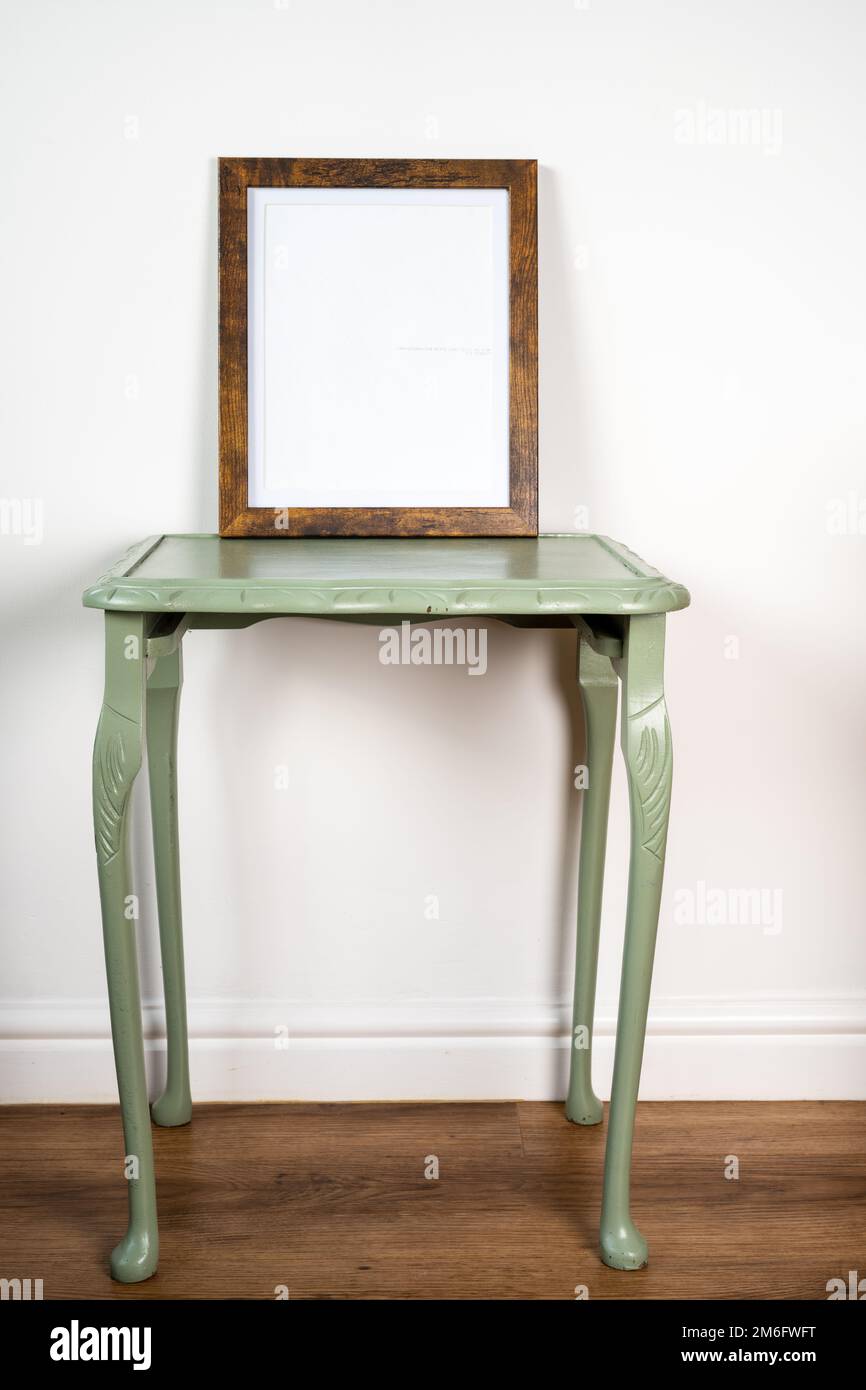 retro green table against a clean wall background and wooden floor with ...