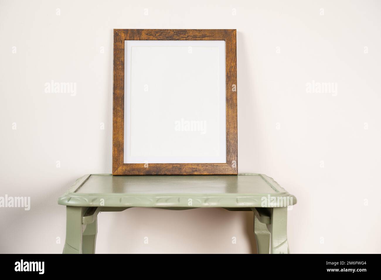 simple picture photo frame mock up on a green retro small table plain ...