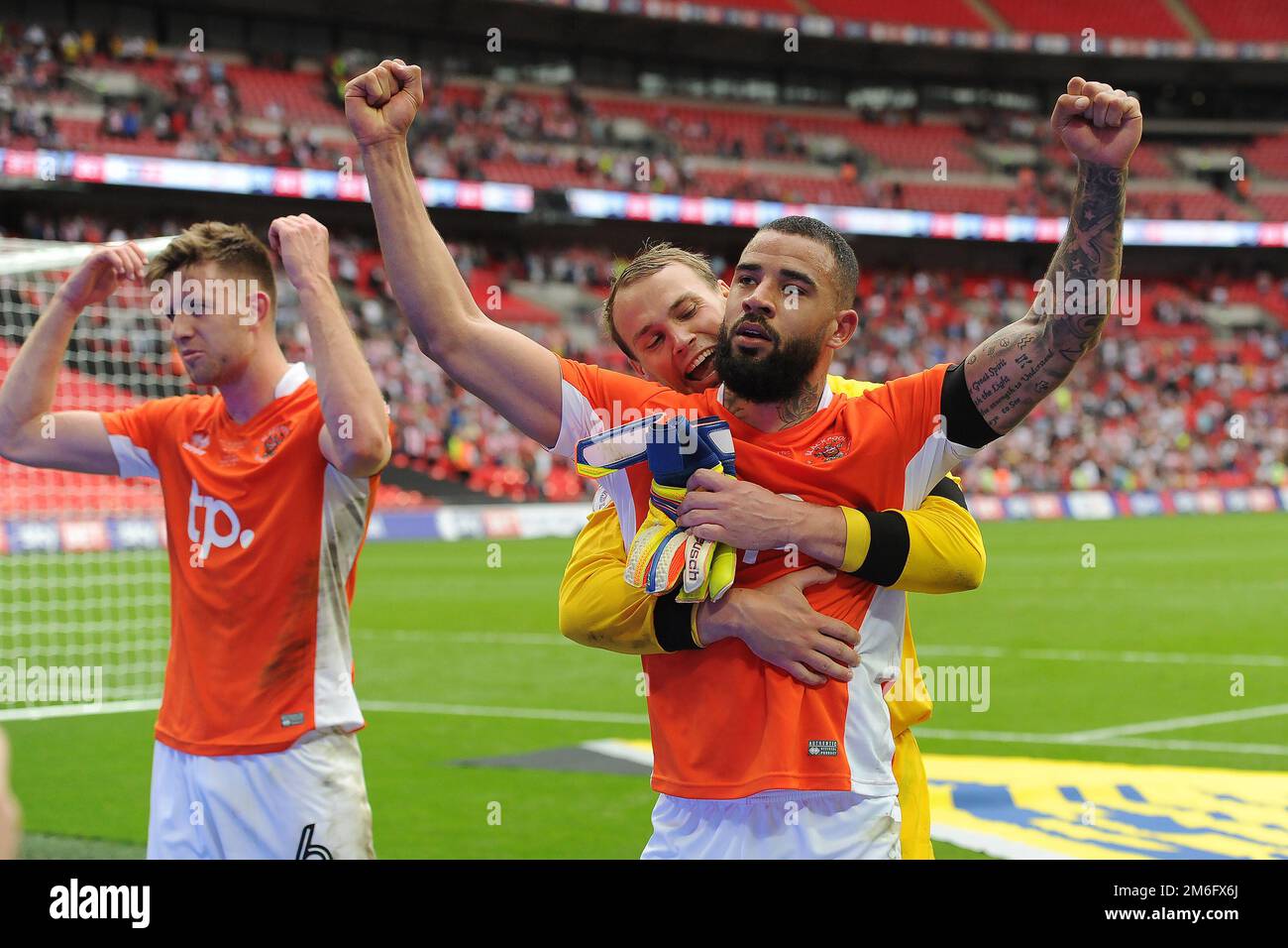 Kyle Vassell of Blackpool celebrates with Sam Slocombe of Blackpool ...