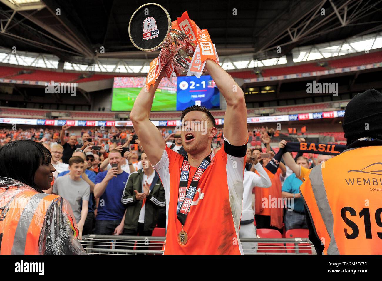 Will Aimson of Blackpool lifts the winning trophy - Blackpool v Exeter ...