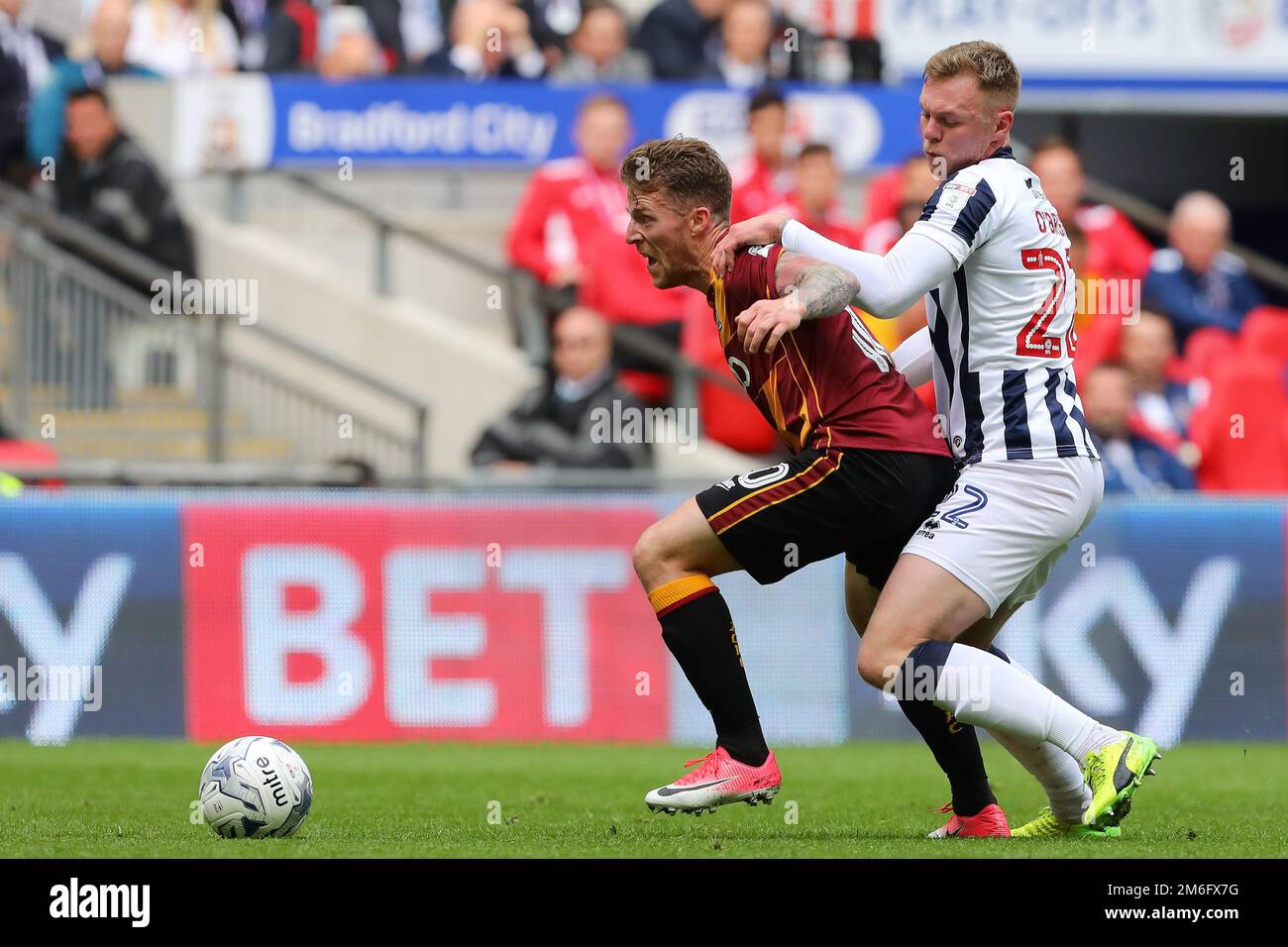 Billy Clarke of Bradford City and Aiden O'Brien of Millwall fight for ...