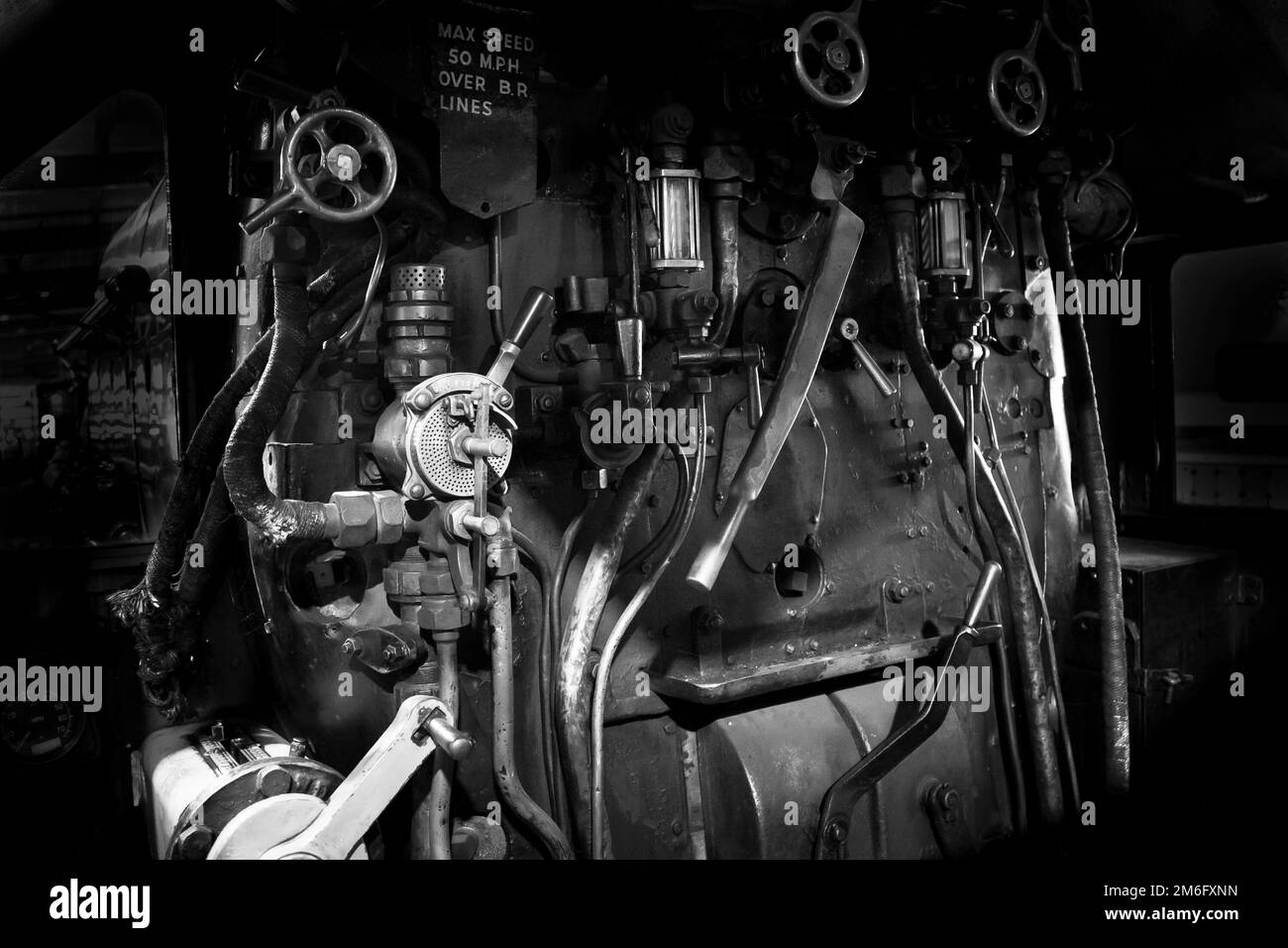 Inside perspective of a British steam locomotive engine cab in black ...