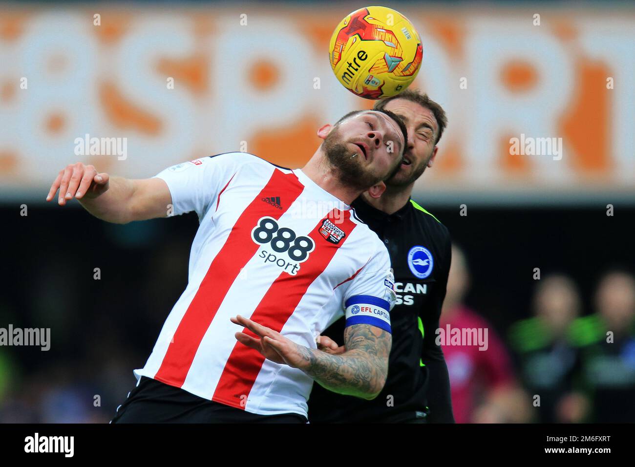 Harlee Dean of Brentford clashes heads with Glenn Murray of Brighton ...