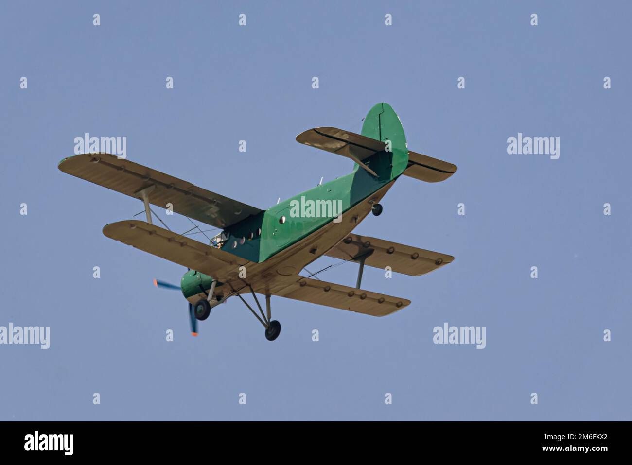Light-engine propeller biplane aircraft AN-2 flying in the sky Stock ...