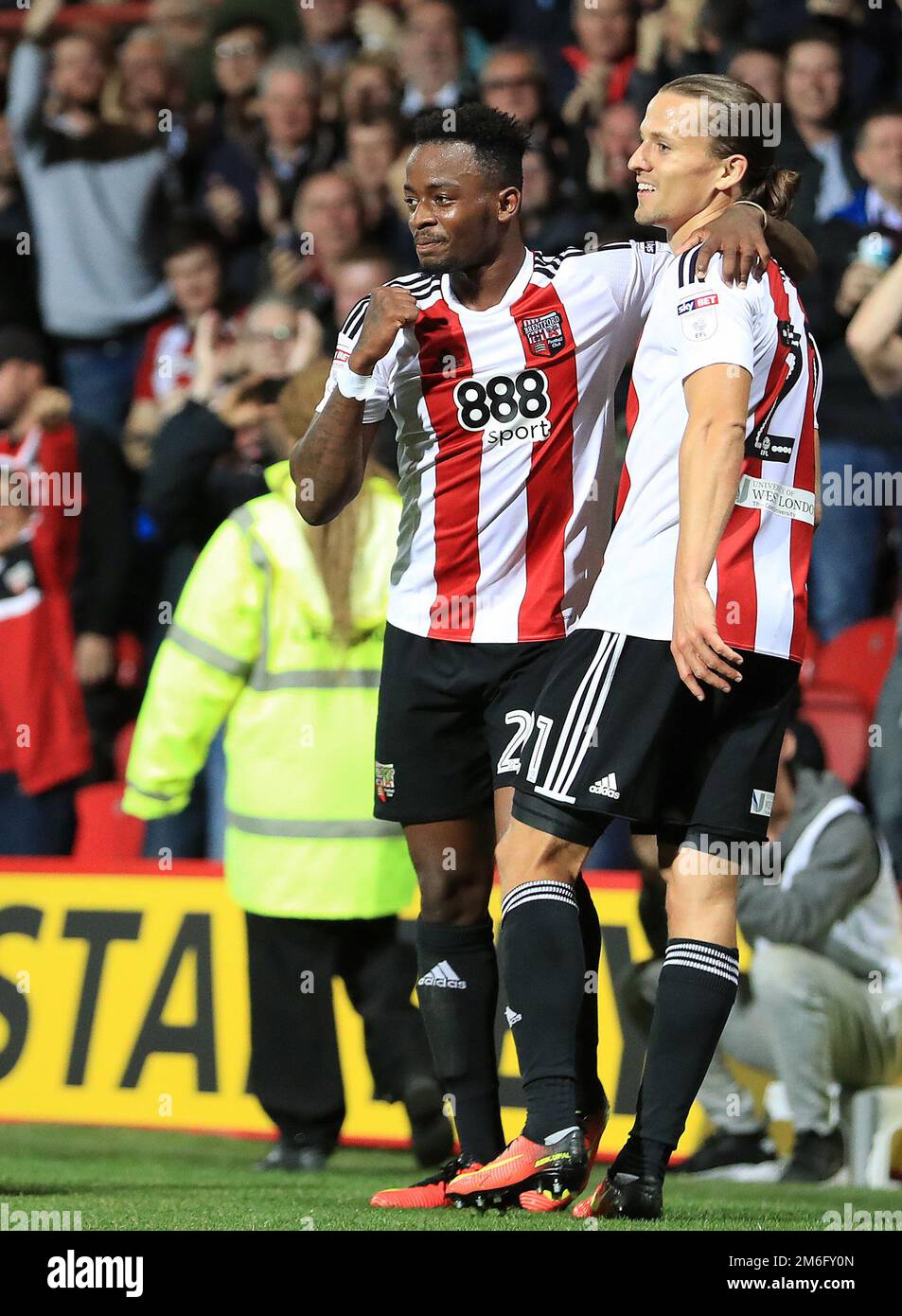 Josh Clarke of Brentford celebrates with Lasse Vibe of Brentford after ...