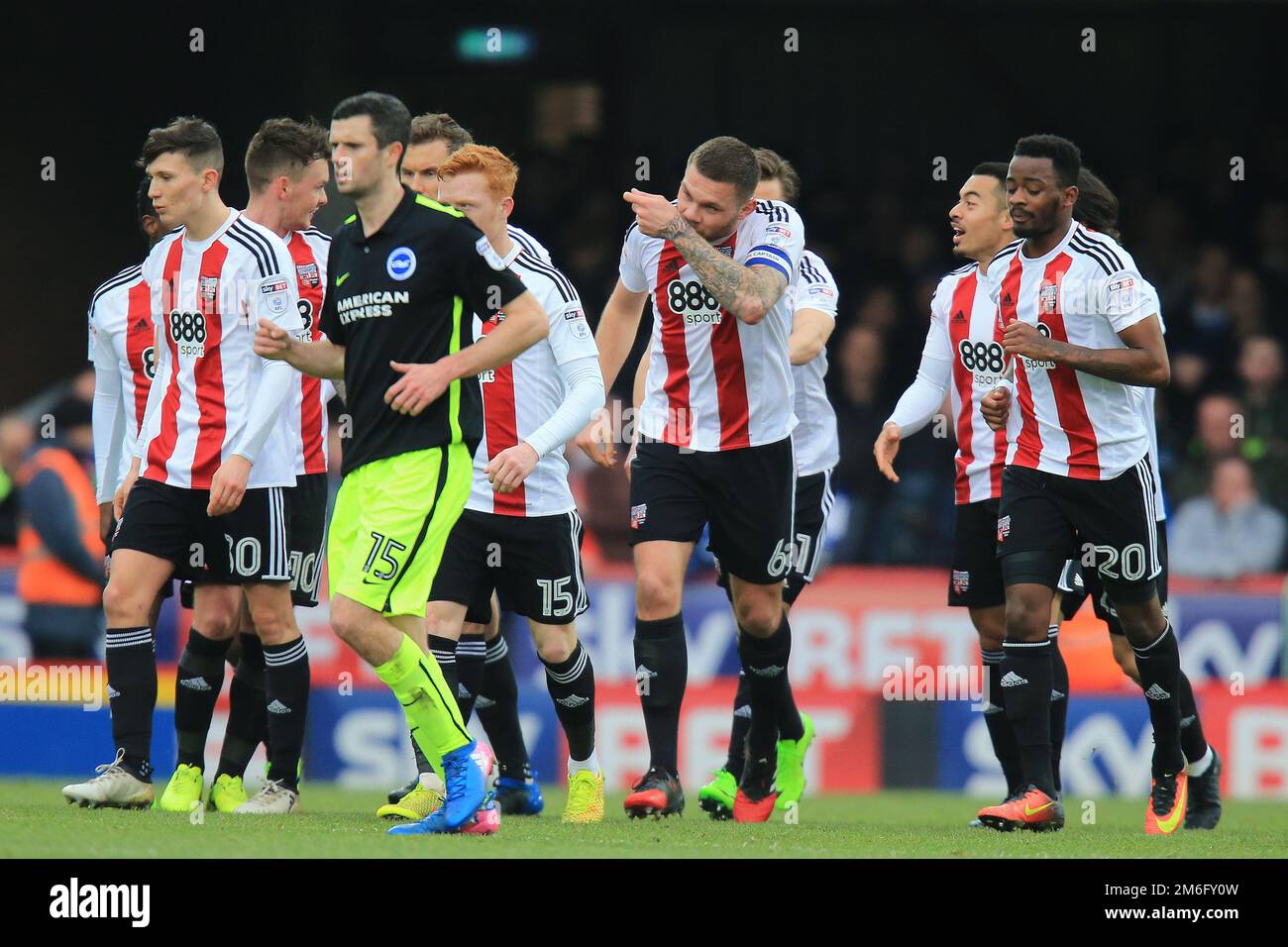 Harlee Dean of Brentford kisses his arm as he scores making it 2-0 ...