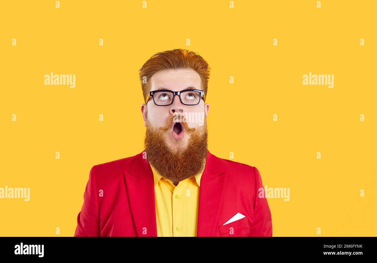 Funny bearded chubby man with shocked and amazment facial expression ...