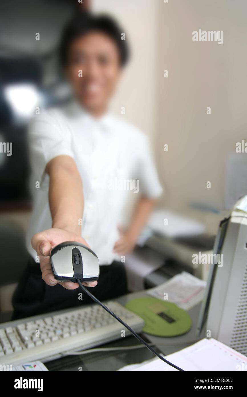 man giving the computer mouse blur face at bacground Stock Photo - Alamy