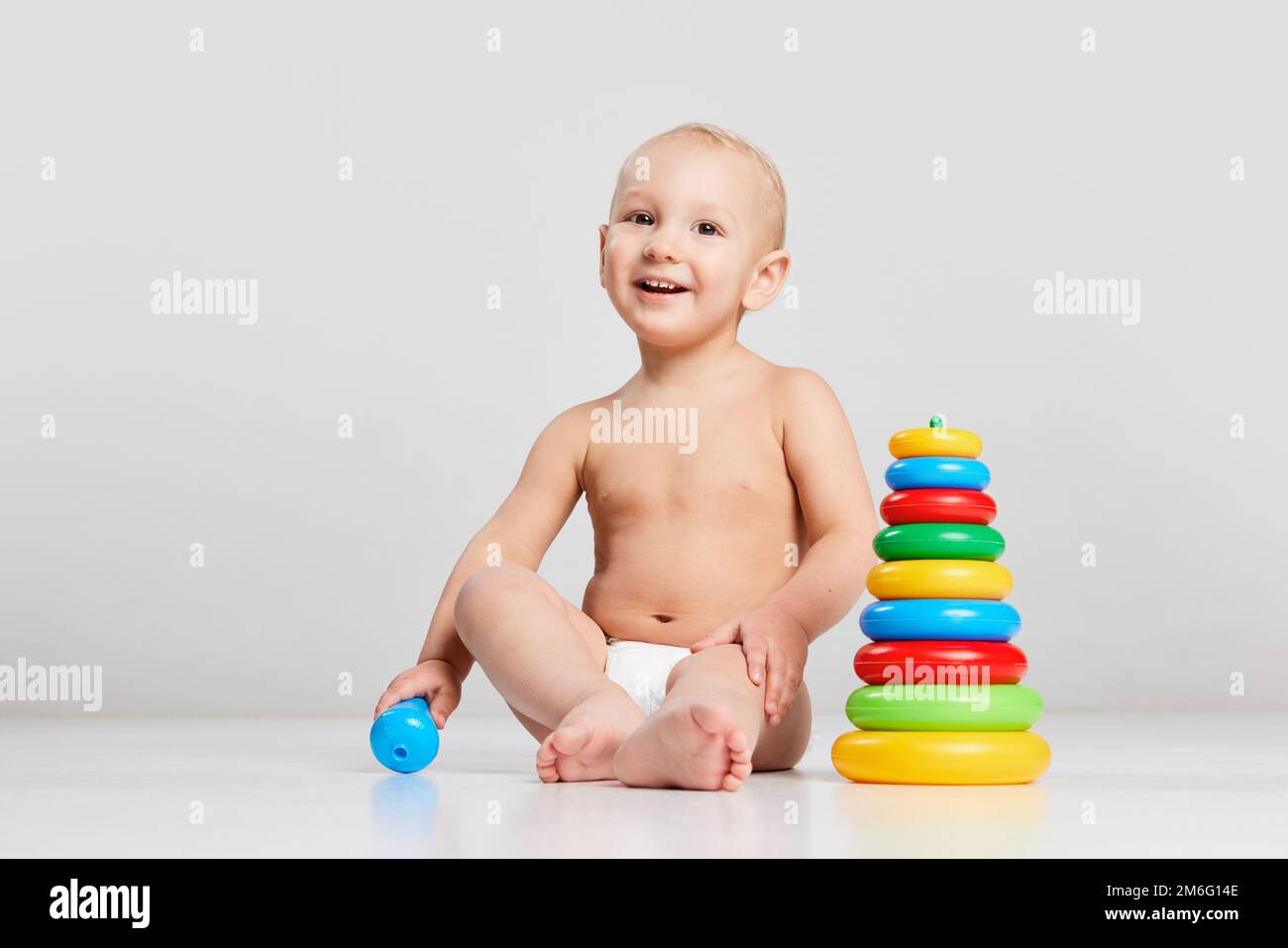 Studio shot of cute infant, little child baby toddler wearing nappy ...