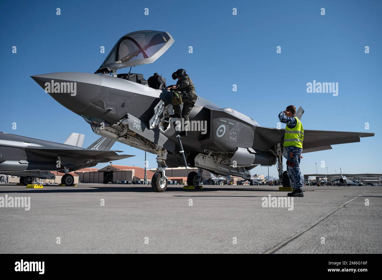 A Royal Australian Air Force (RAAF) pilot climbs into a F-35A Lightning II at Nellis Air Force ...