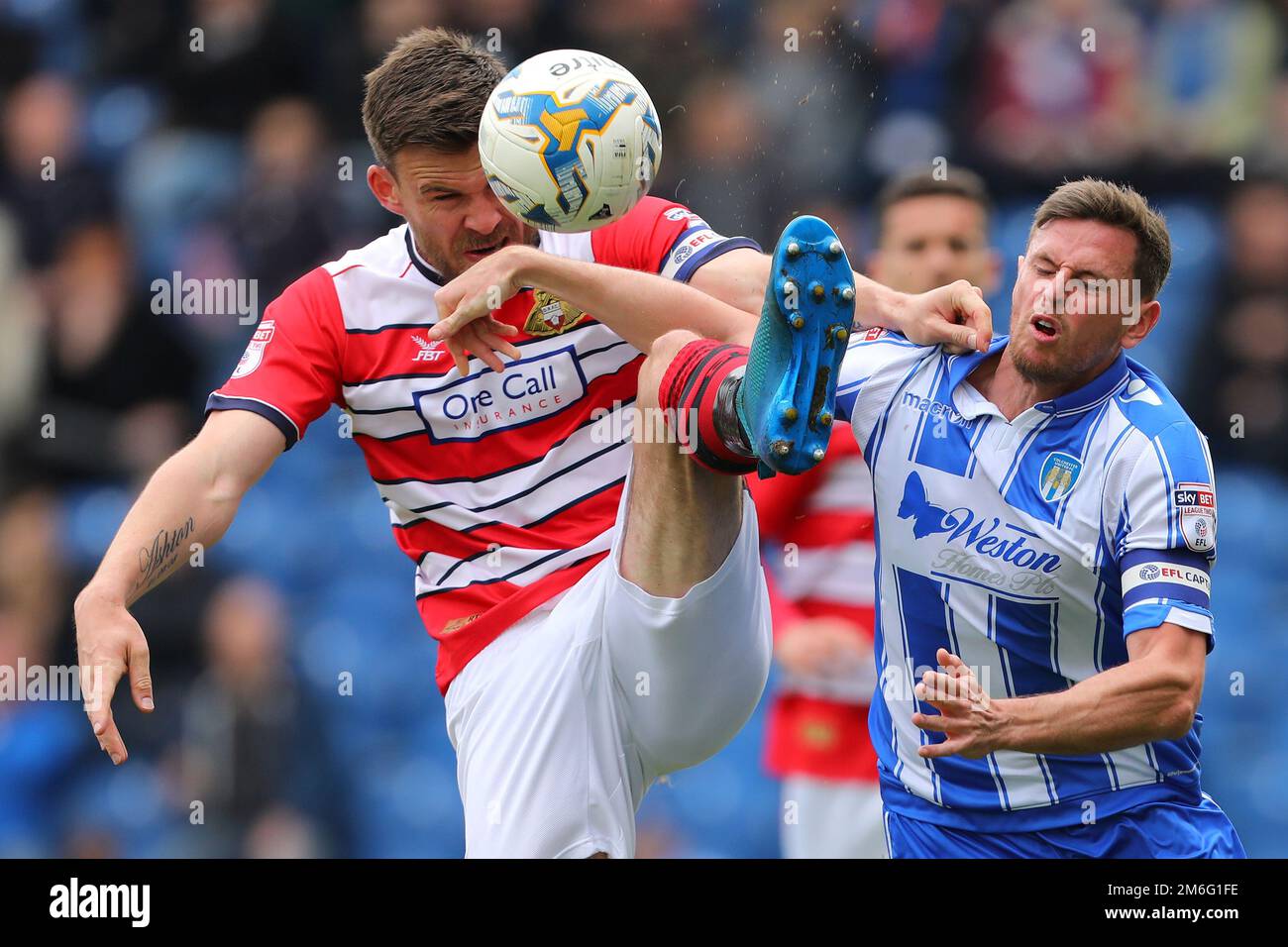 Chris Porter of Colchester United and Andrew Butler of Doncaster Rovers ...